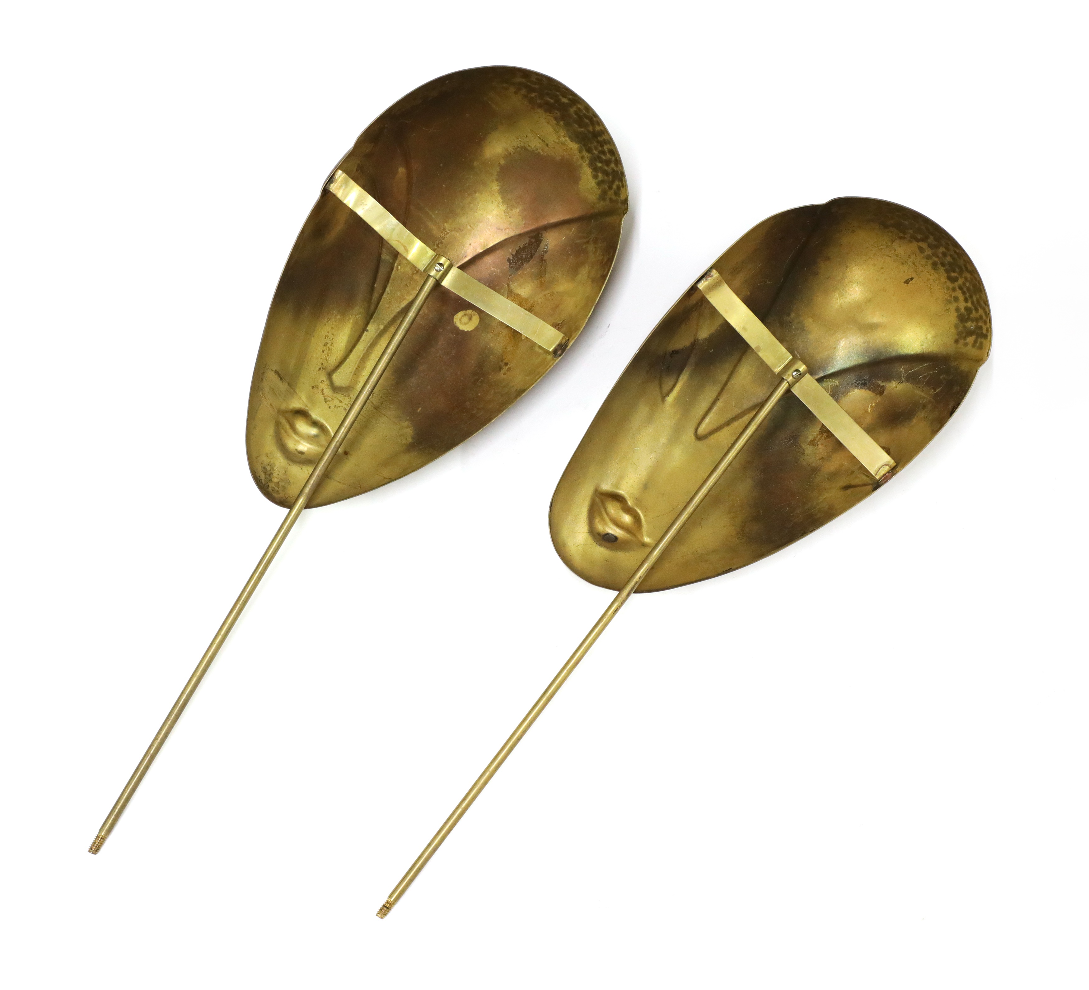 Lot 327 - A pair of Hagenauer-style brass masks,