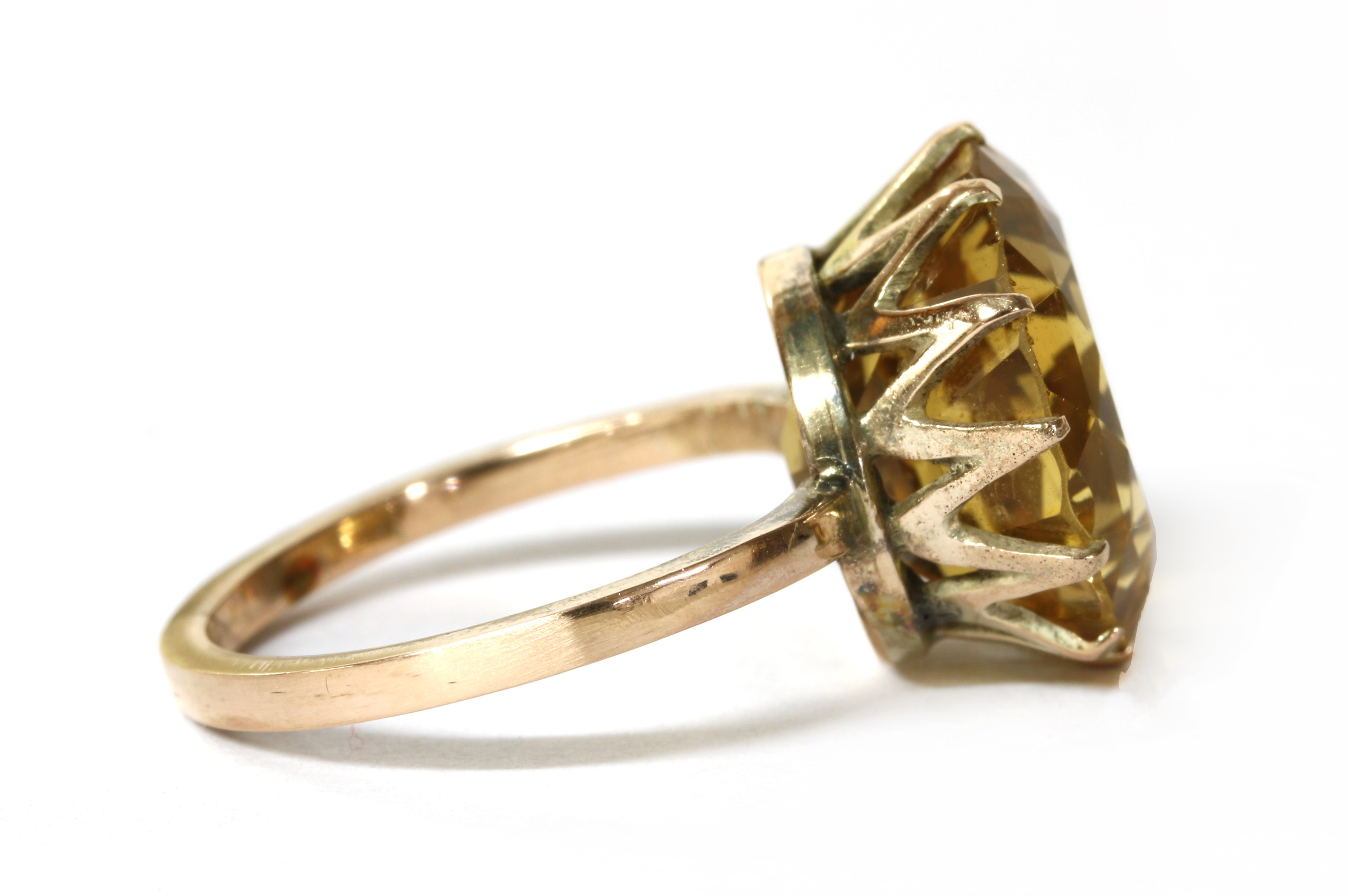 Lot 15 - A gold single stone citrine ring,
