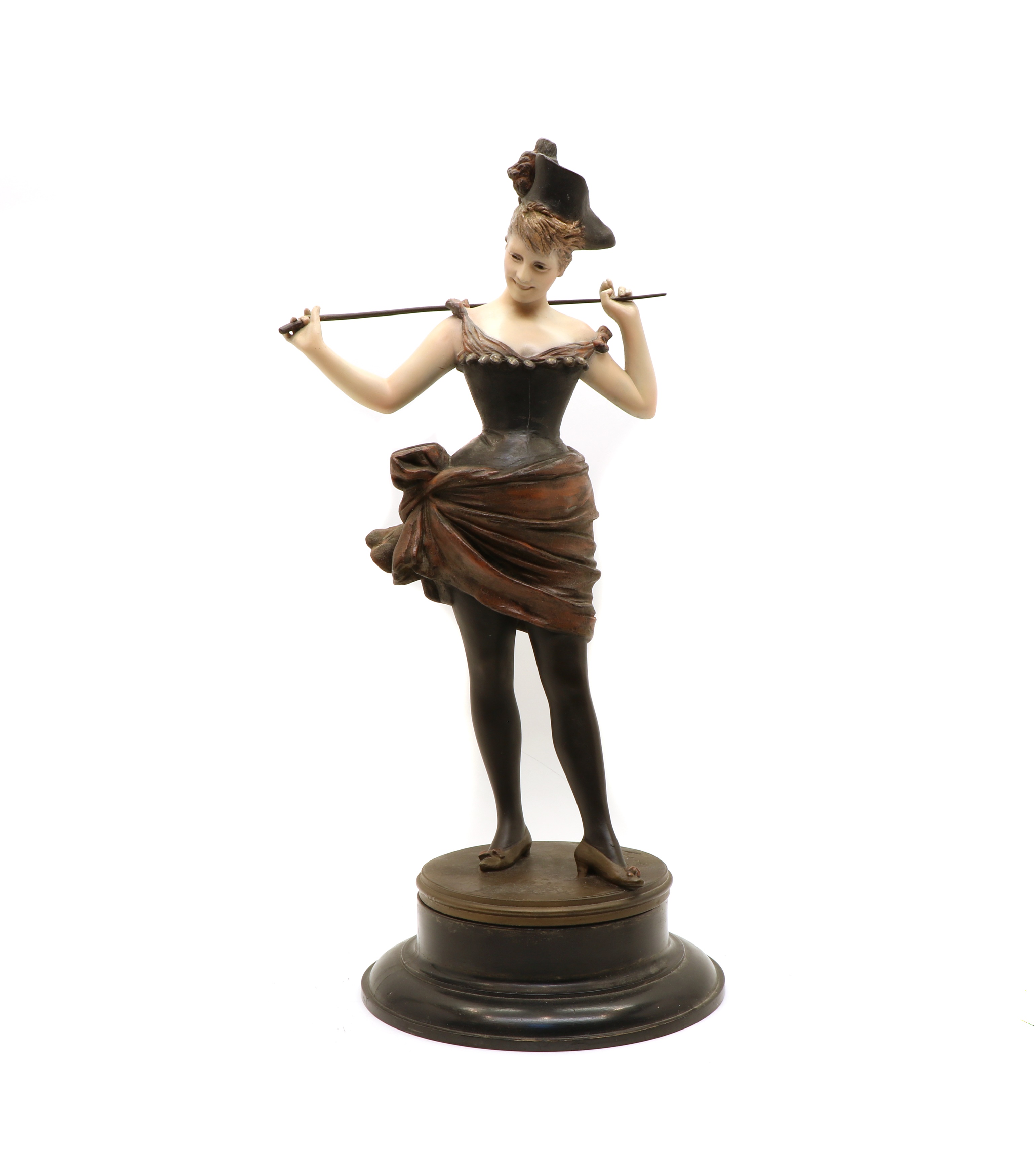Lot 178 - A spelter figure of a lady holding a cane,