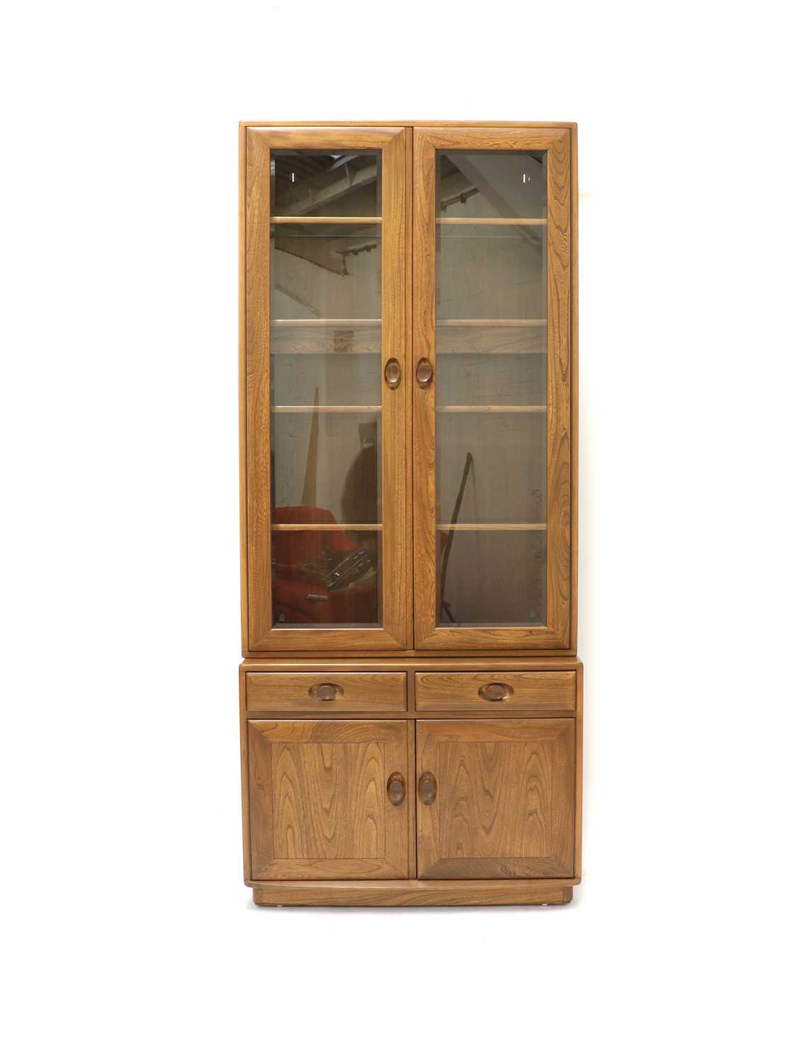 Lot 571 - An Ercol elm 'Windsor' display cabinet