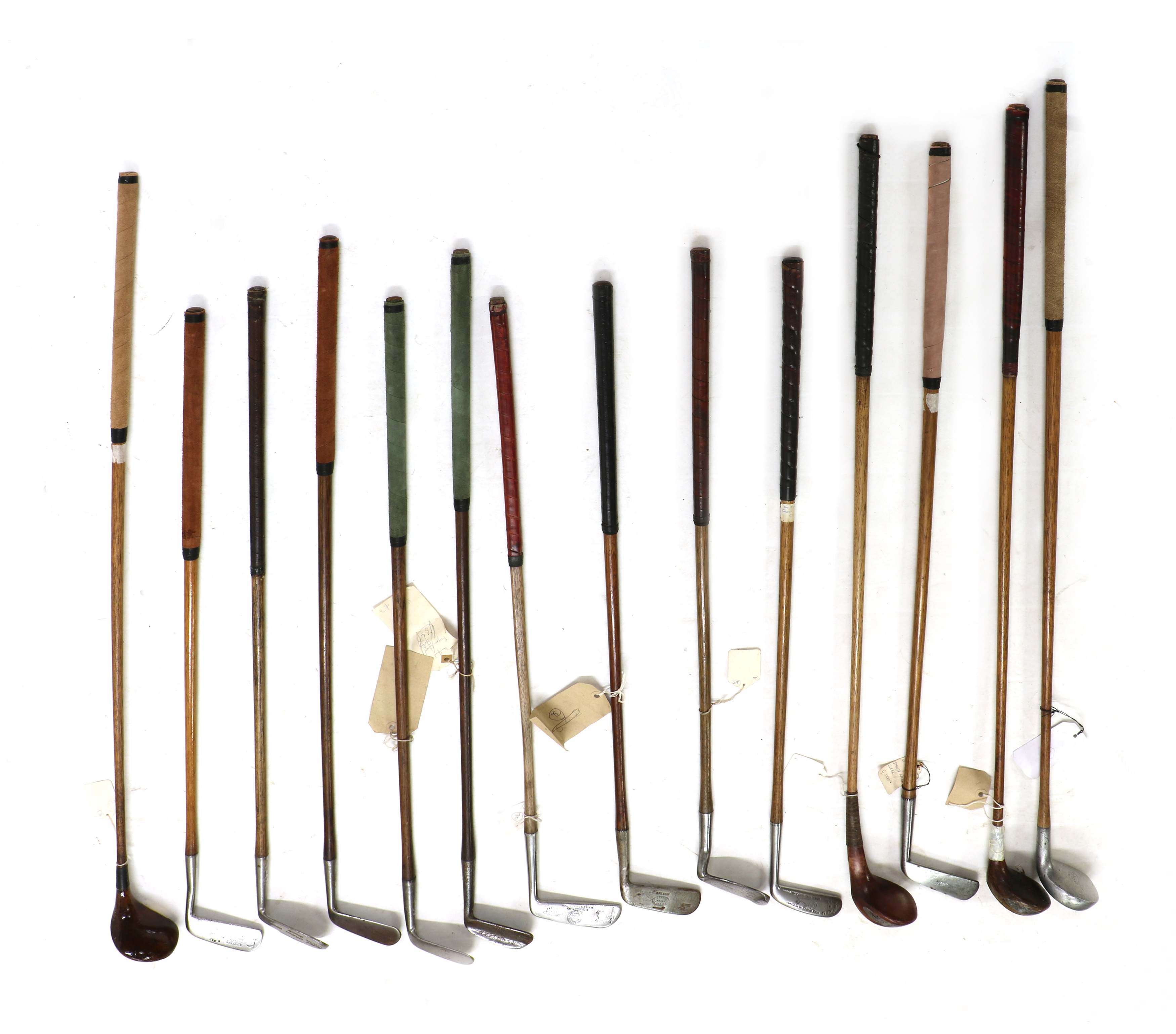 Lot 229 - A collection of hickory shafted golf clubs,