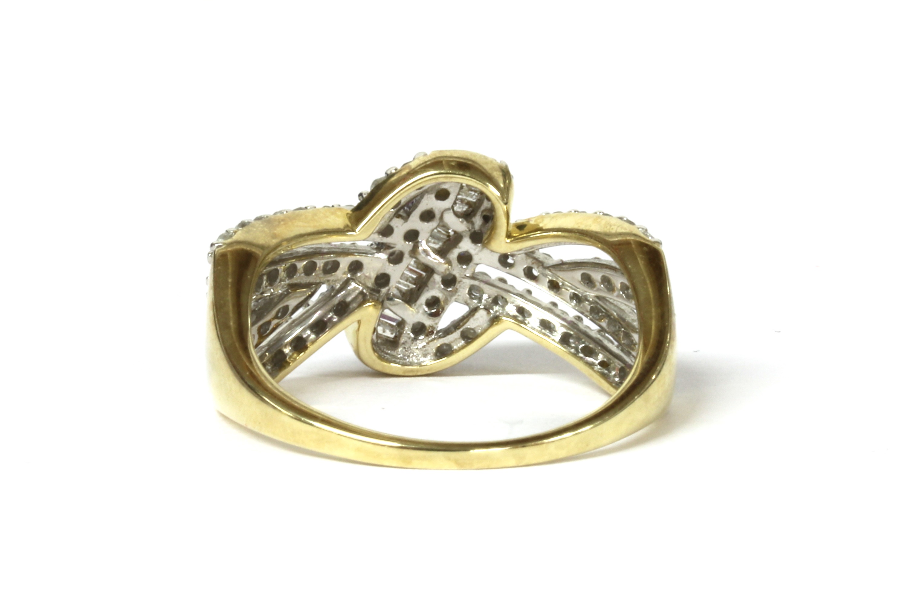 Lot 168 - A 9ct gold diamond set knot design ring,