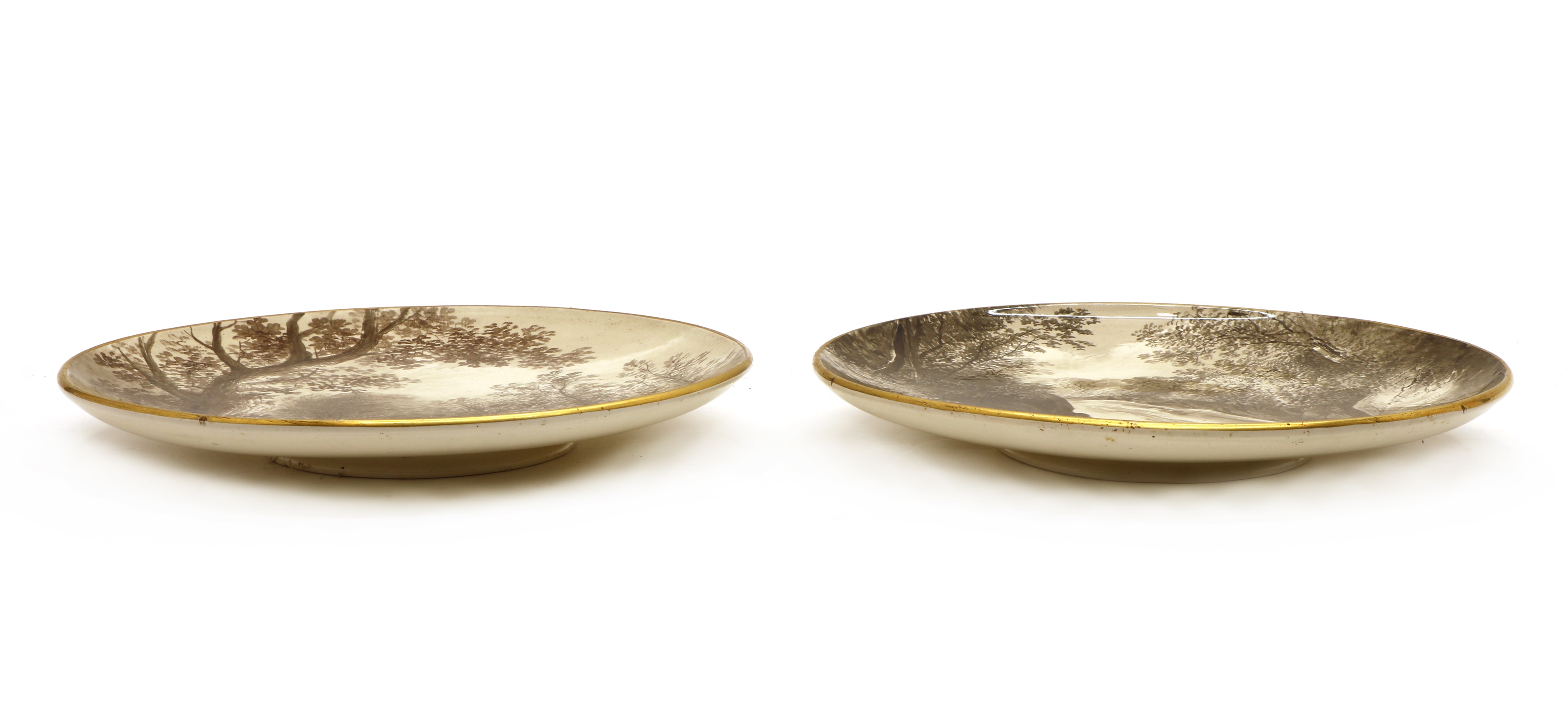 Lot 72 - A pair of painted pottery plaques,