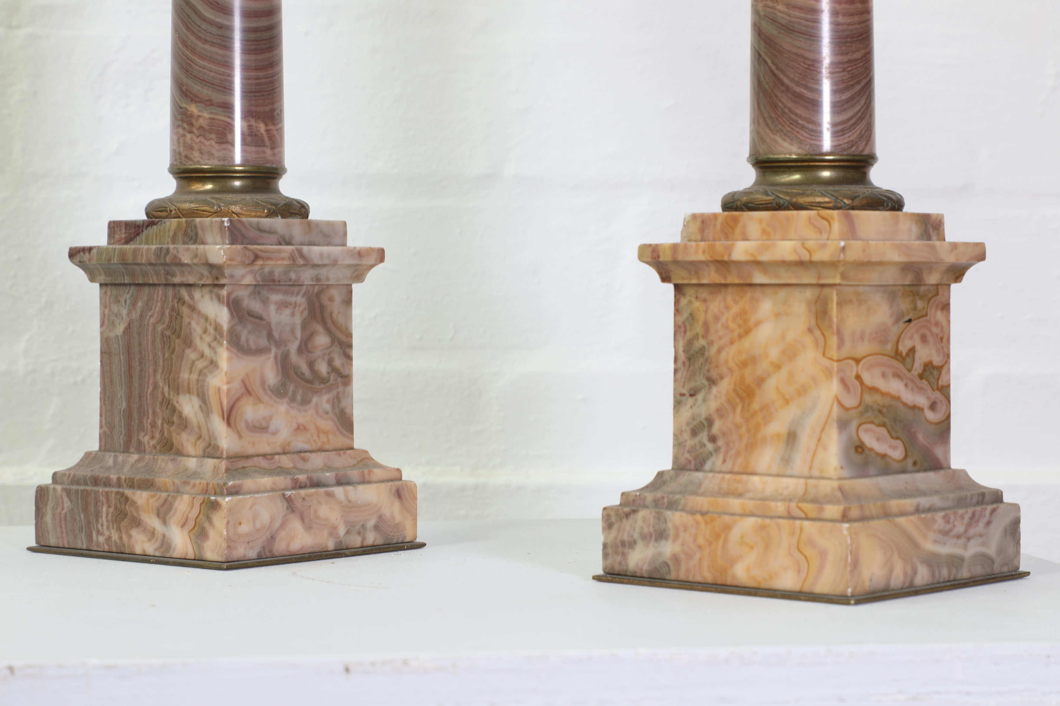 Lot 225 - A pair of veined pink marble lamp bases,