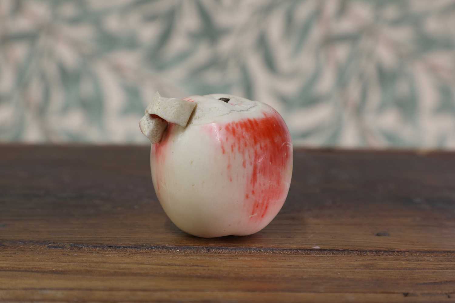 A carved and stained ivory okimono | Barnebys