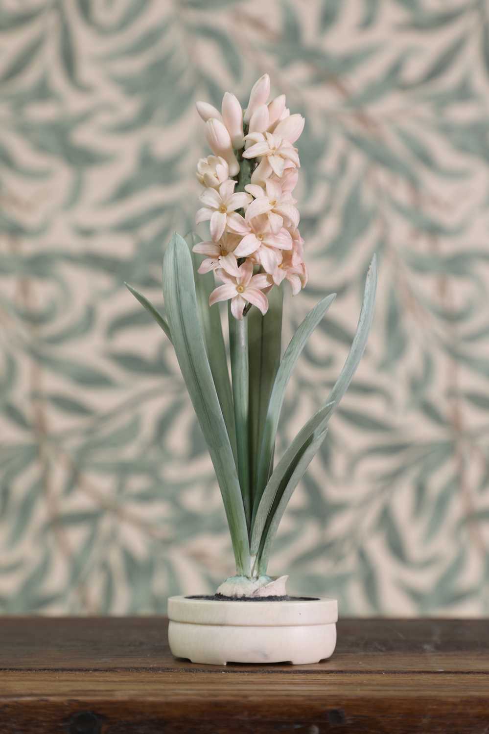 Lot 431 - A carved and stained ivory okimono,