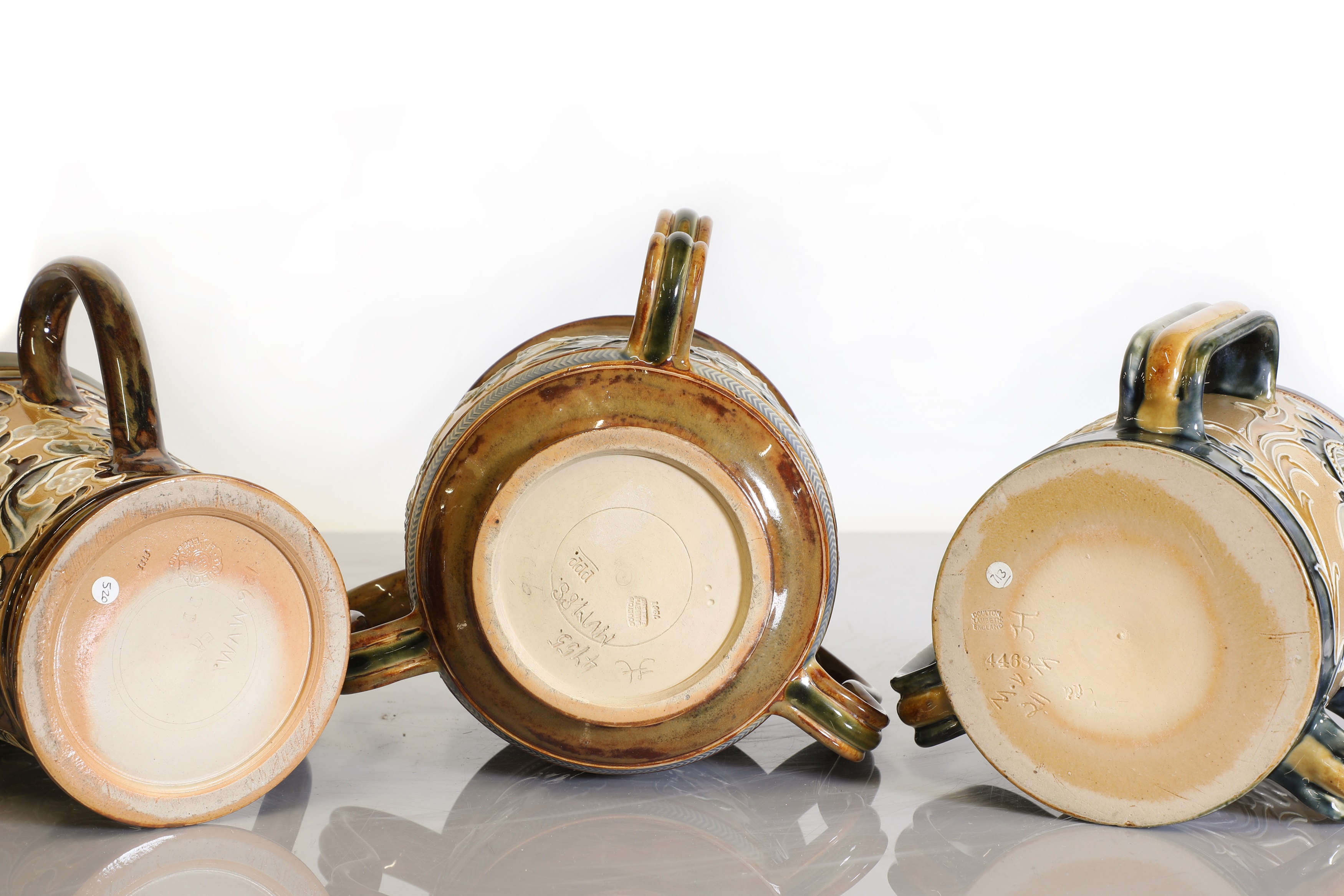 Lot 30 - Three Doulton Lambeth stoneware loving cups,