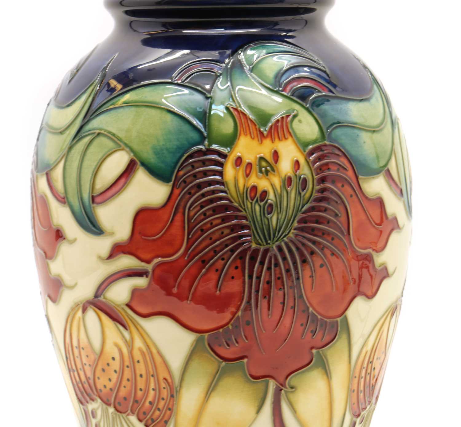 Lot 99 - A Moorcroft pottery 'Anna Lily' pattern table