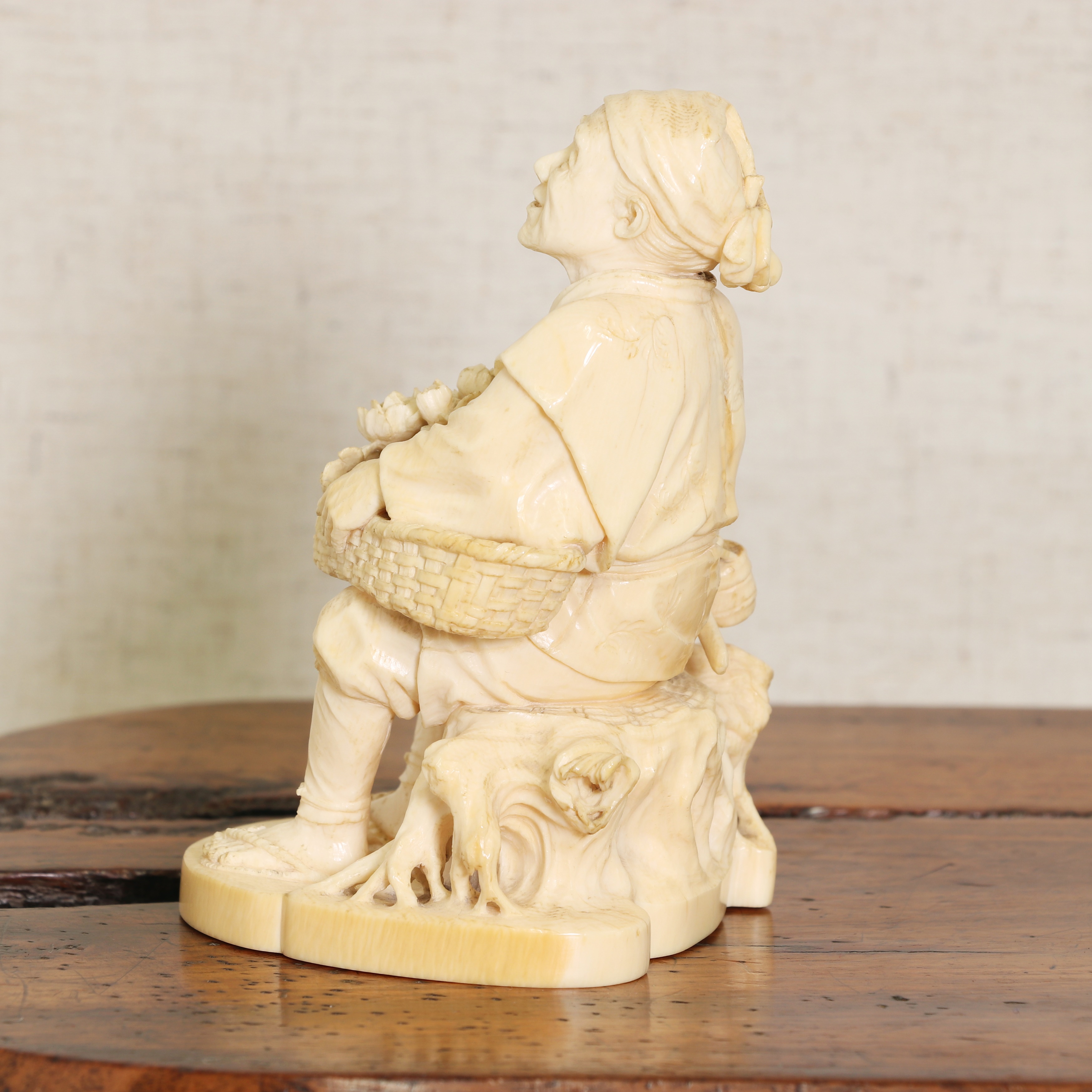 Lot 216 - A Japanese ivory okimono,