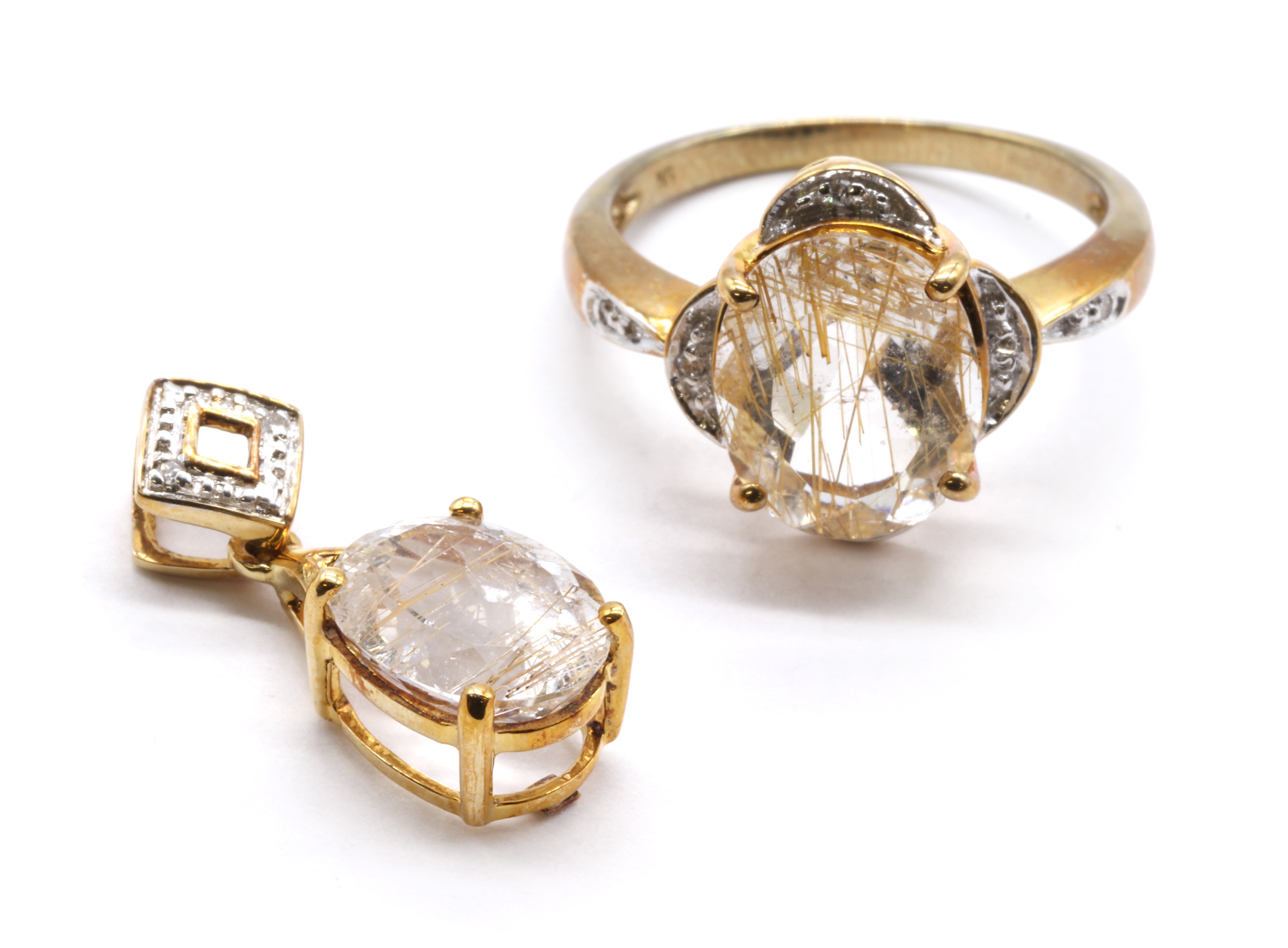 Lot 212 - A 9ct gold rutilated quartz and diamond ring,