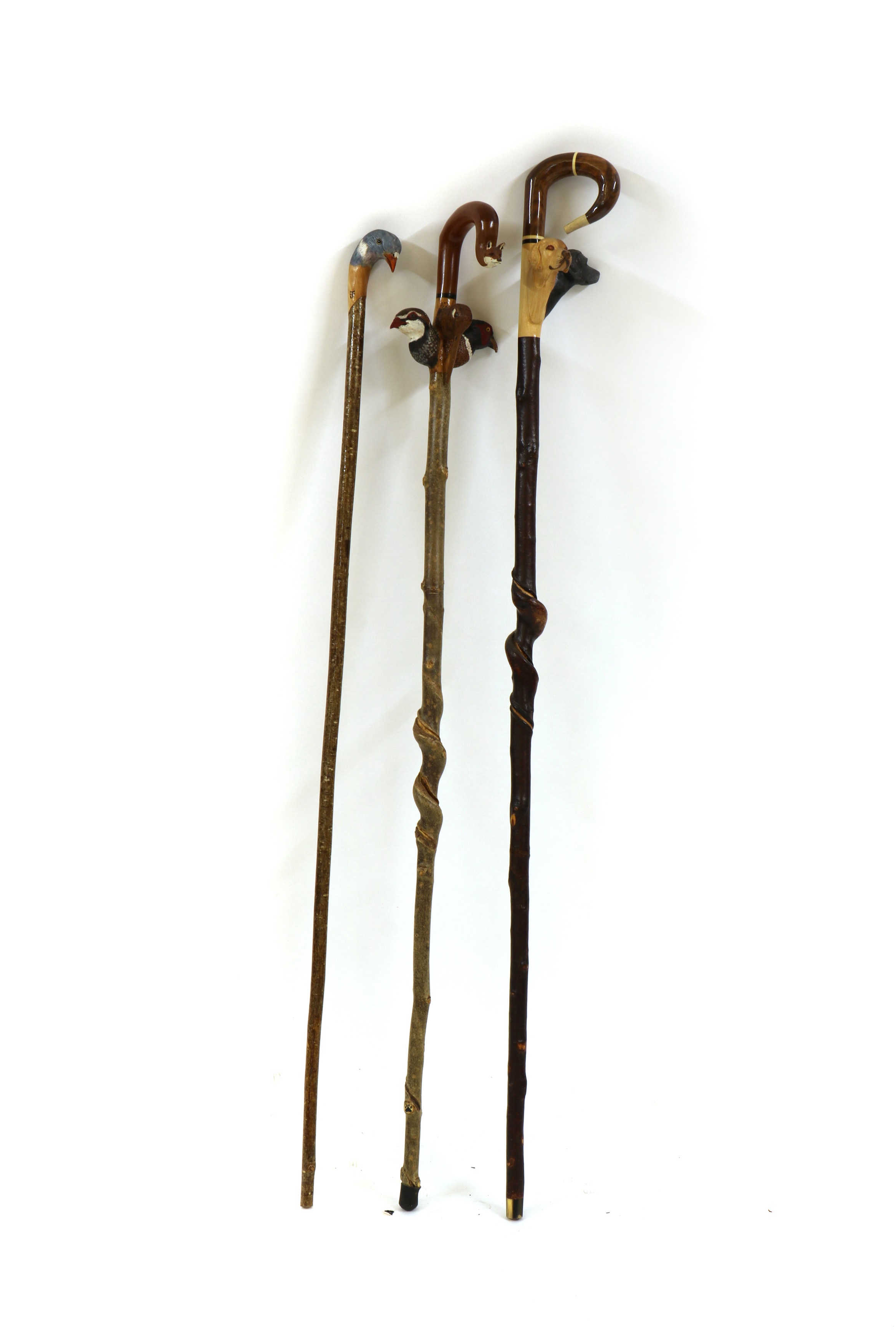 Lot 160 - Three modern carved walking sticks,