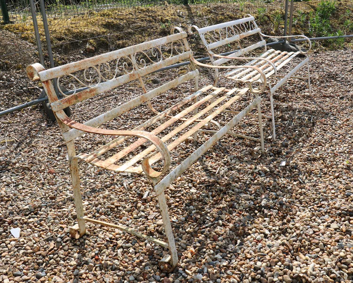 Lot 315 - A pair of wrought iron garden benches