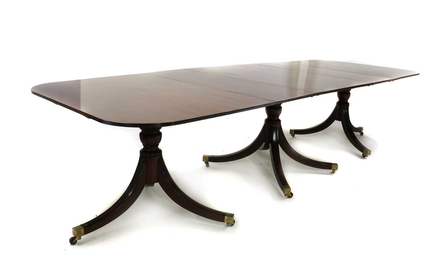 Lot 328 - A Regency style triple pillar mahogany