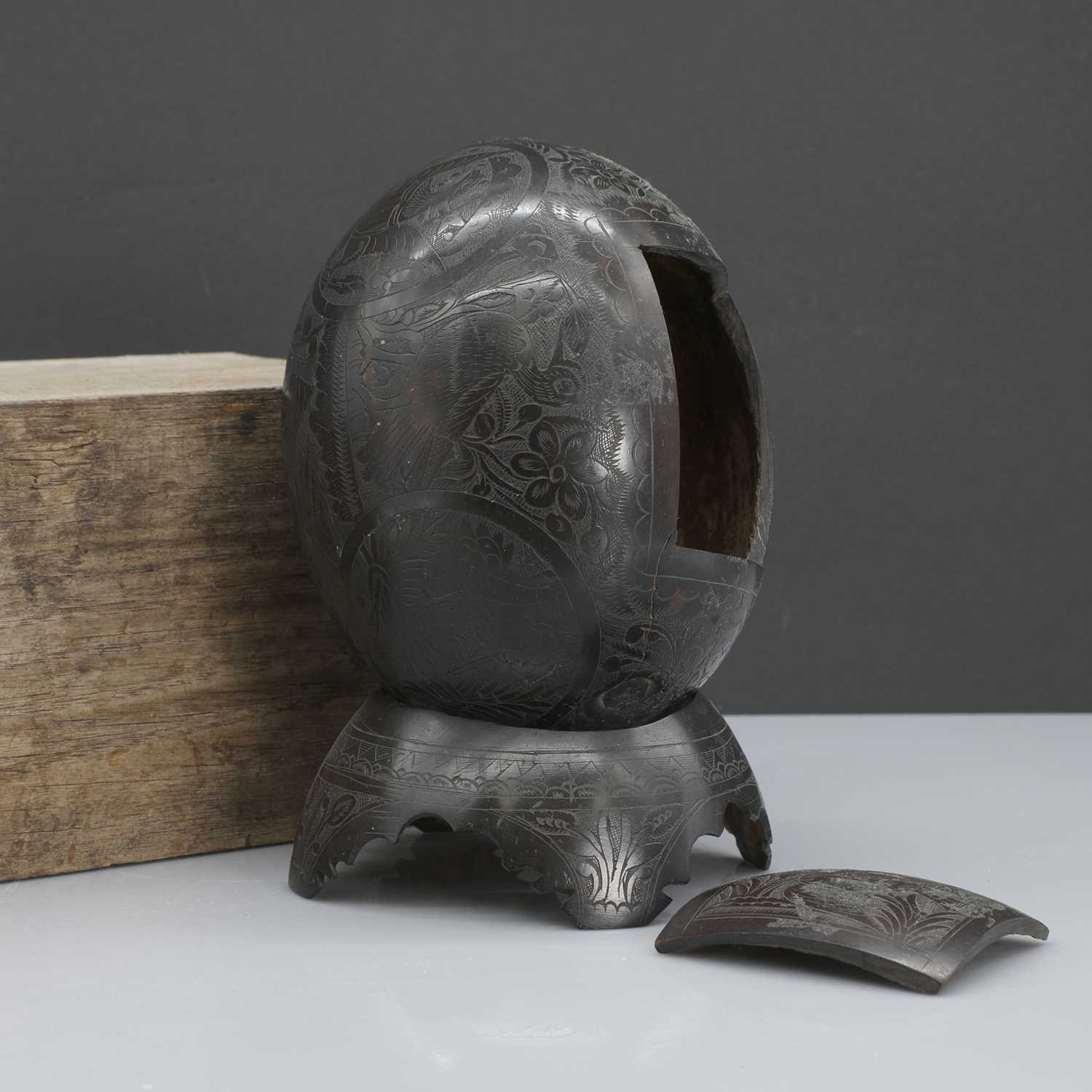 Lot 34 - A commemorative scrimshawed 'bugbear' coconut,