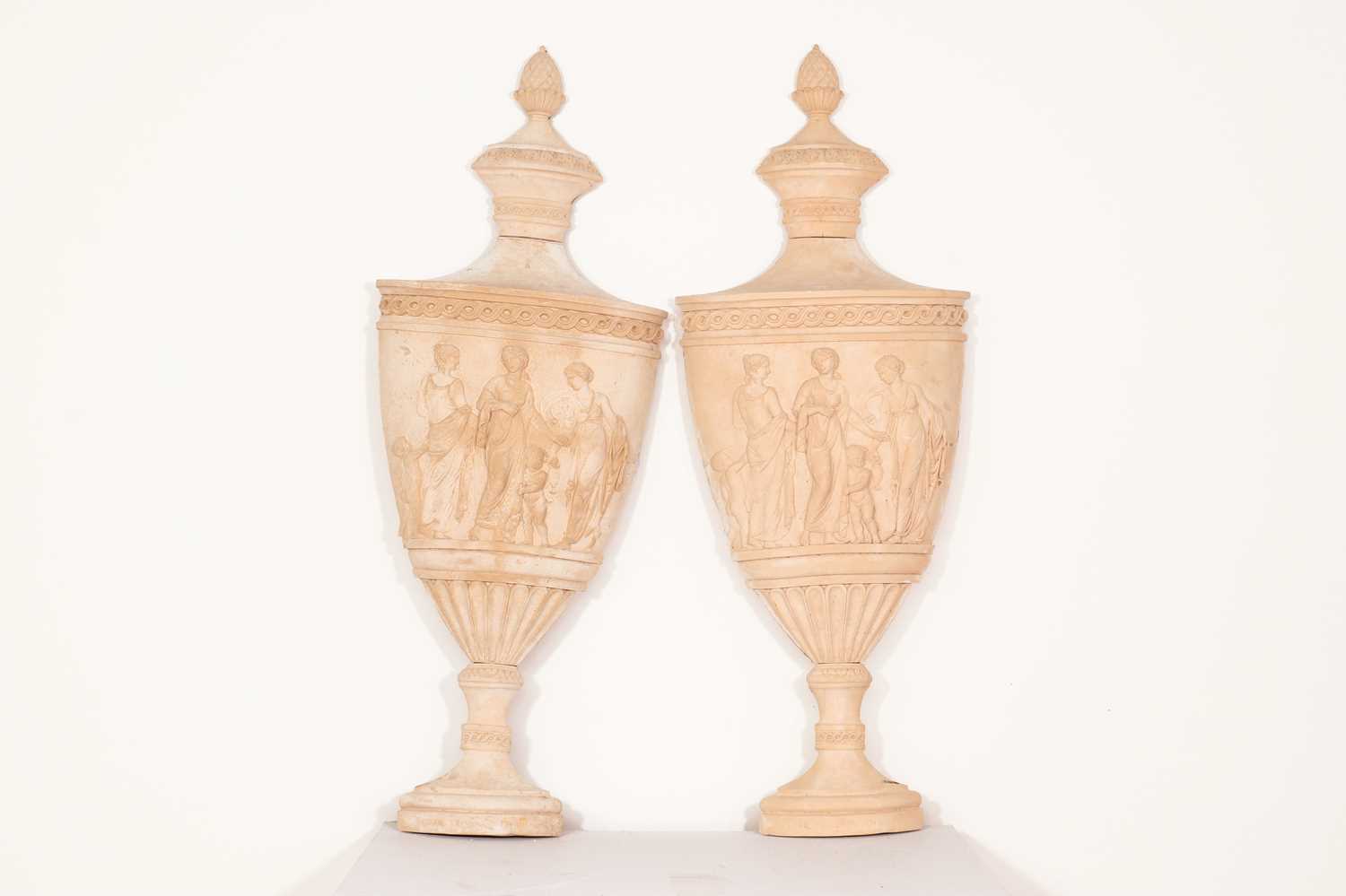 Lot 378 - A pair of flat-back cast composite stone