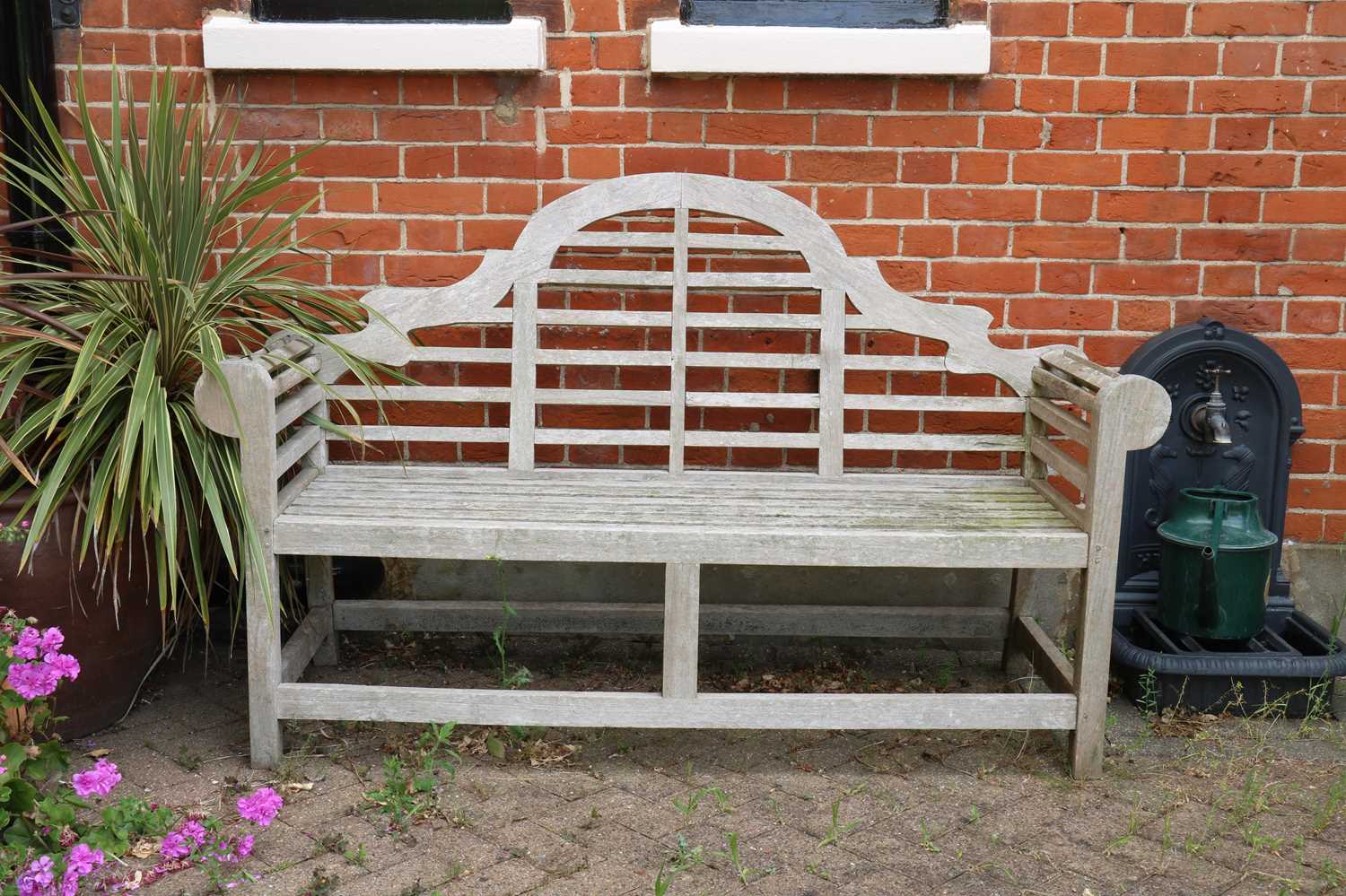 Lot 454 - A teak Lutyens garden bench,