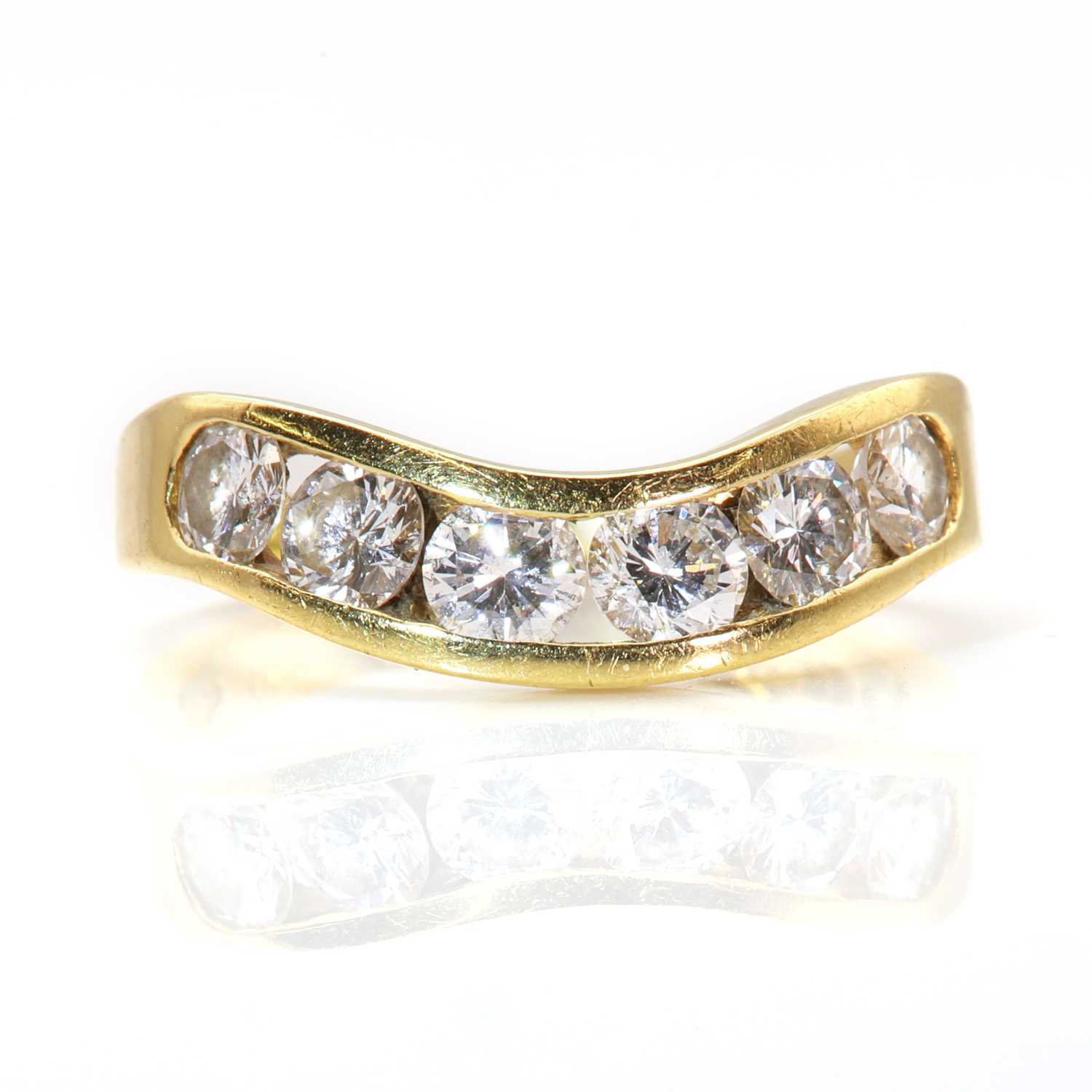 Lot 212 - An 18ct gold diamond set wave head half