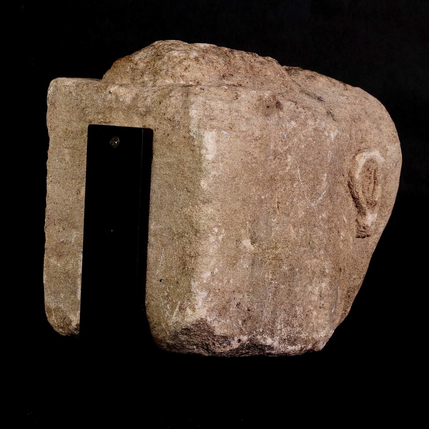 Lot 208 - A Celtic sandstone head with bared teeth,