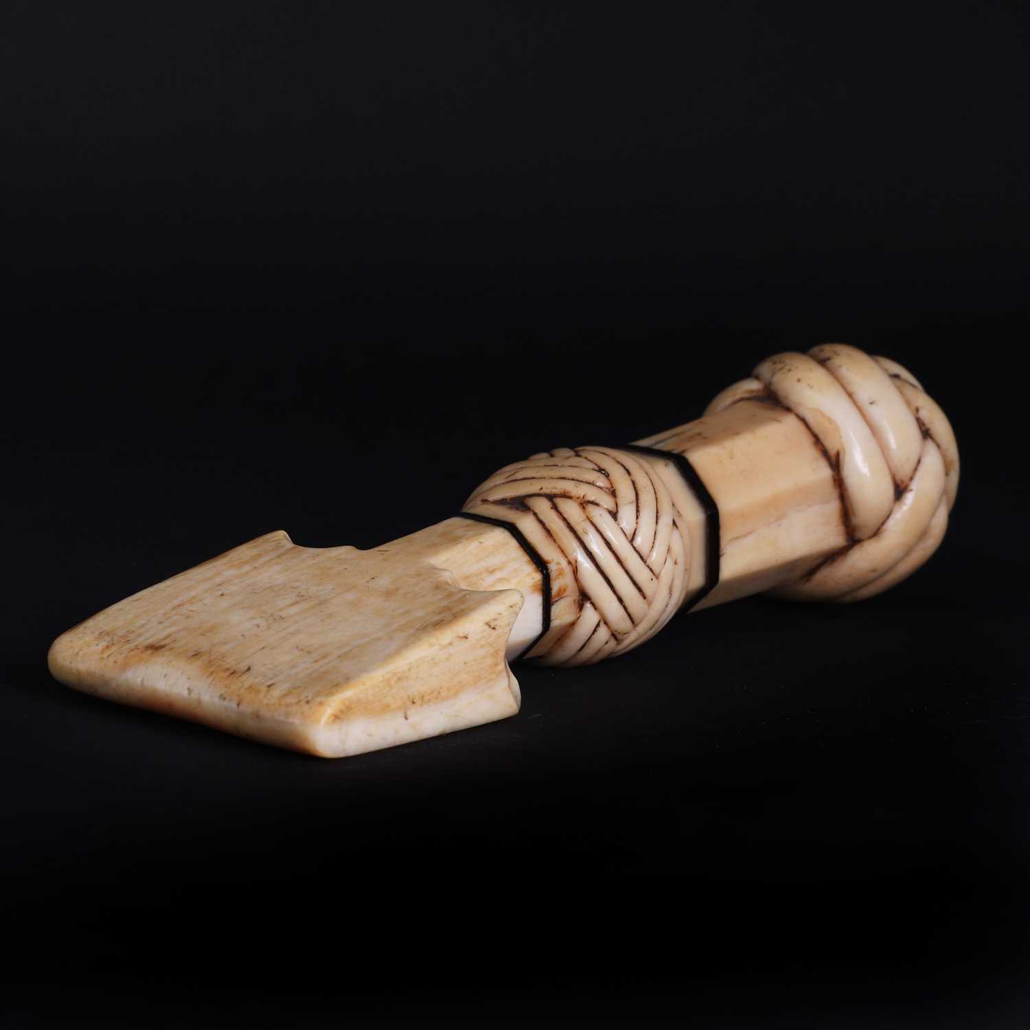 Lot 93 - A sailor's whale tooth seam rubber,