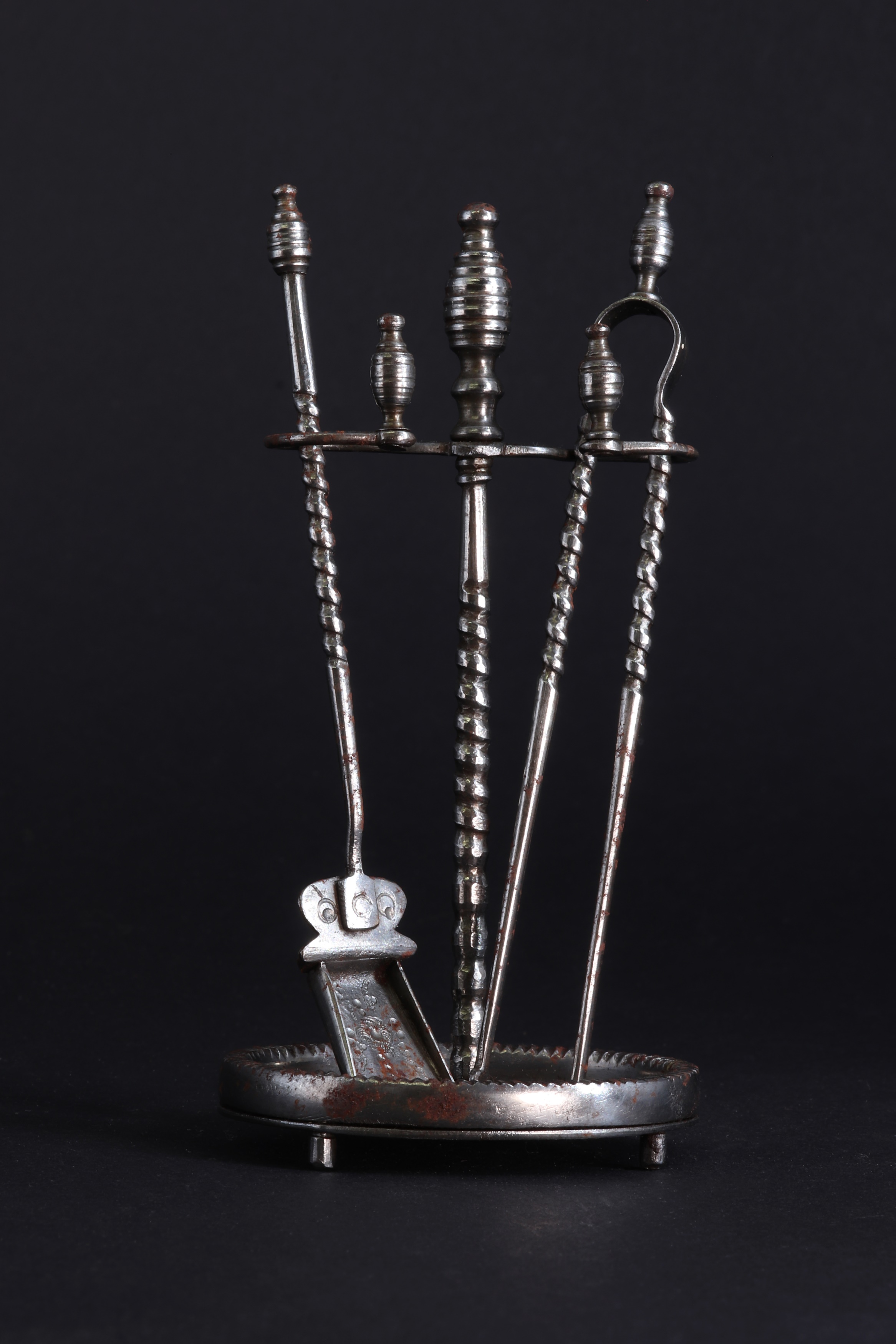 Lot 177 - A set of miniature polished steel fire irons