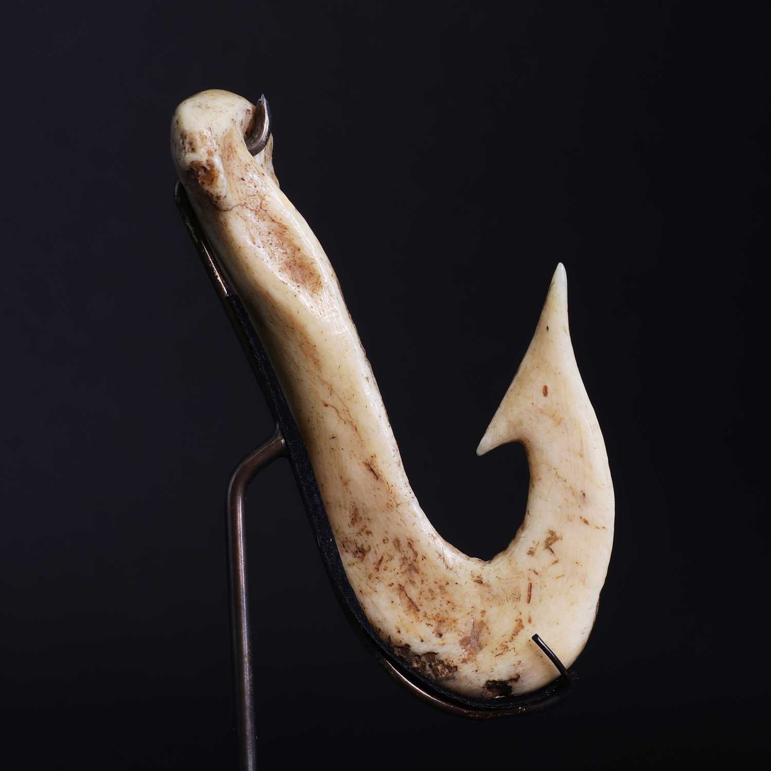 Lot 75 - A Maori bone 'hei matau' fish hook,