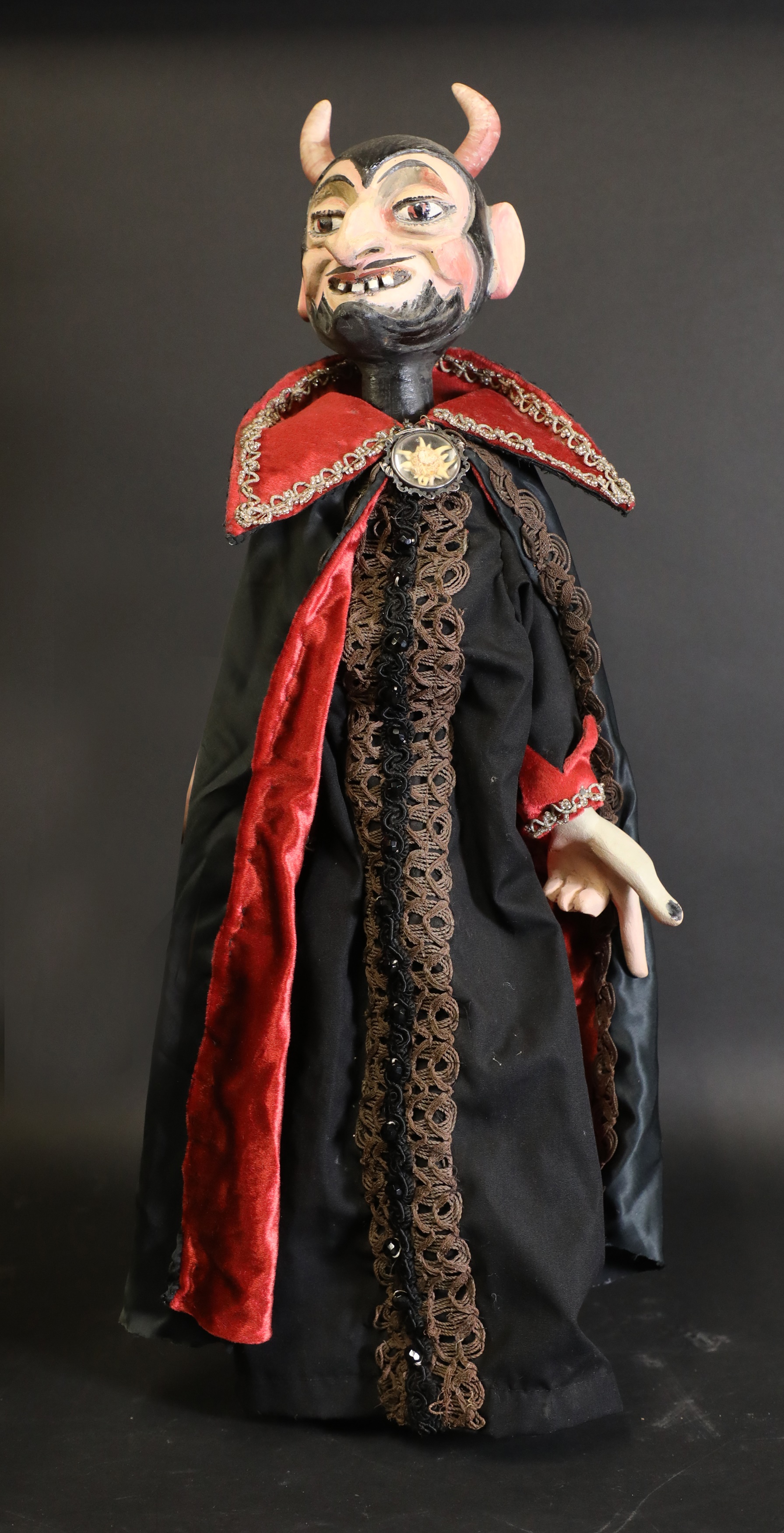 Lot 72 - A carved and painted wooden hand puppet of