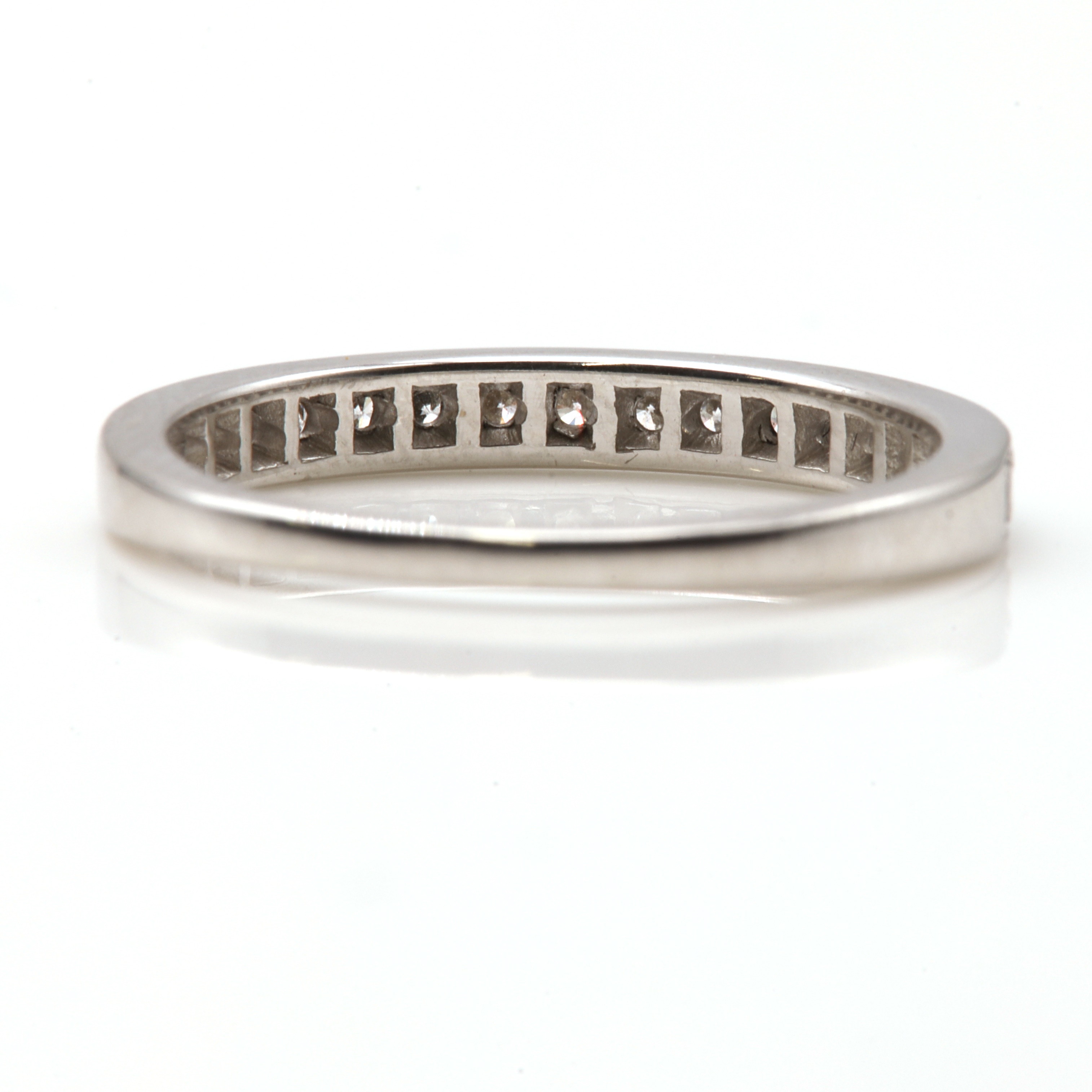 Lot 366 - An 18ct white gold diamond set half eternity