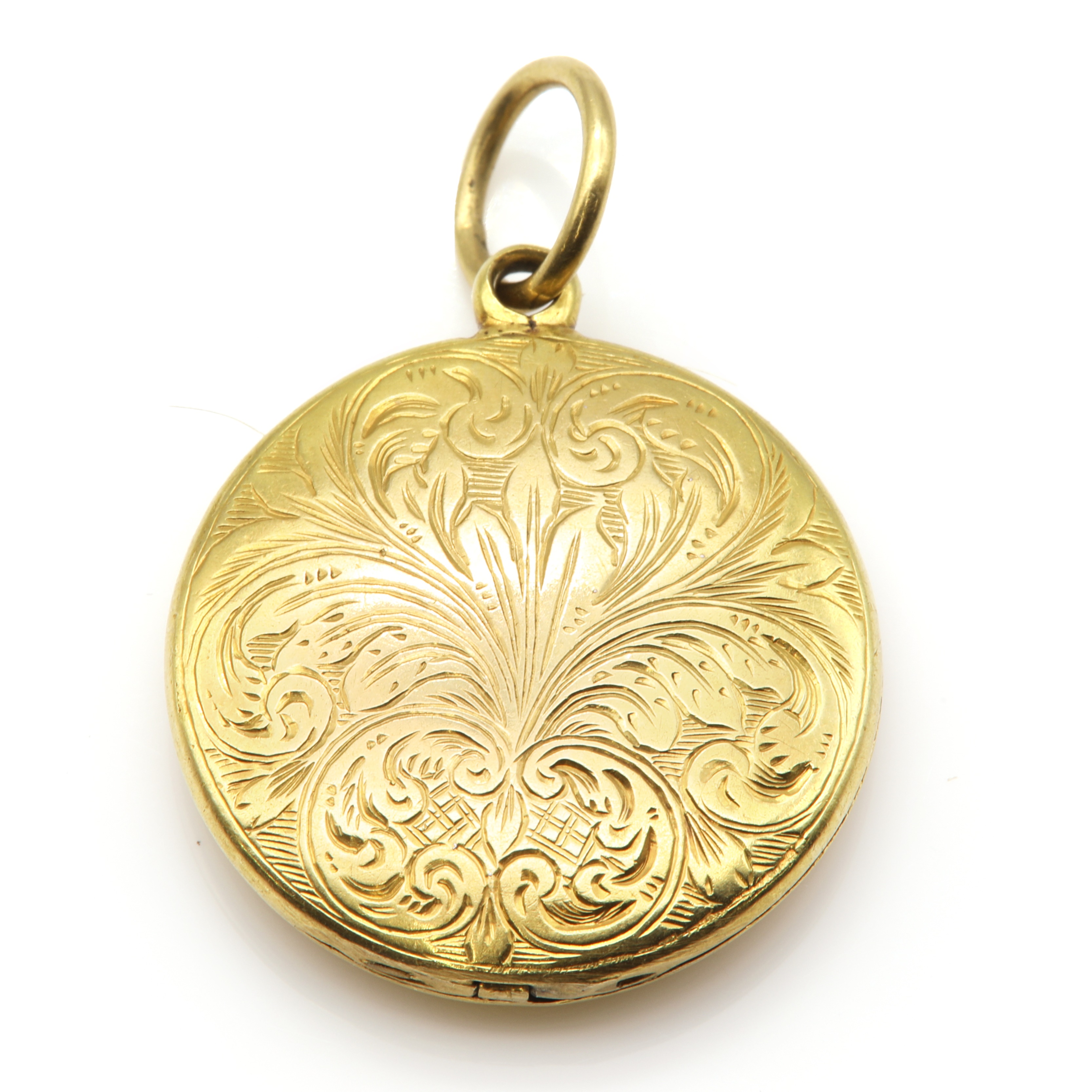 Lot 42 - A circular hinged locket form vinaigrette,