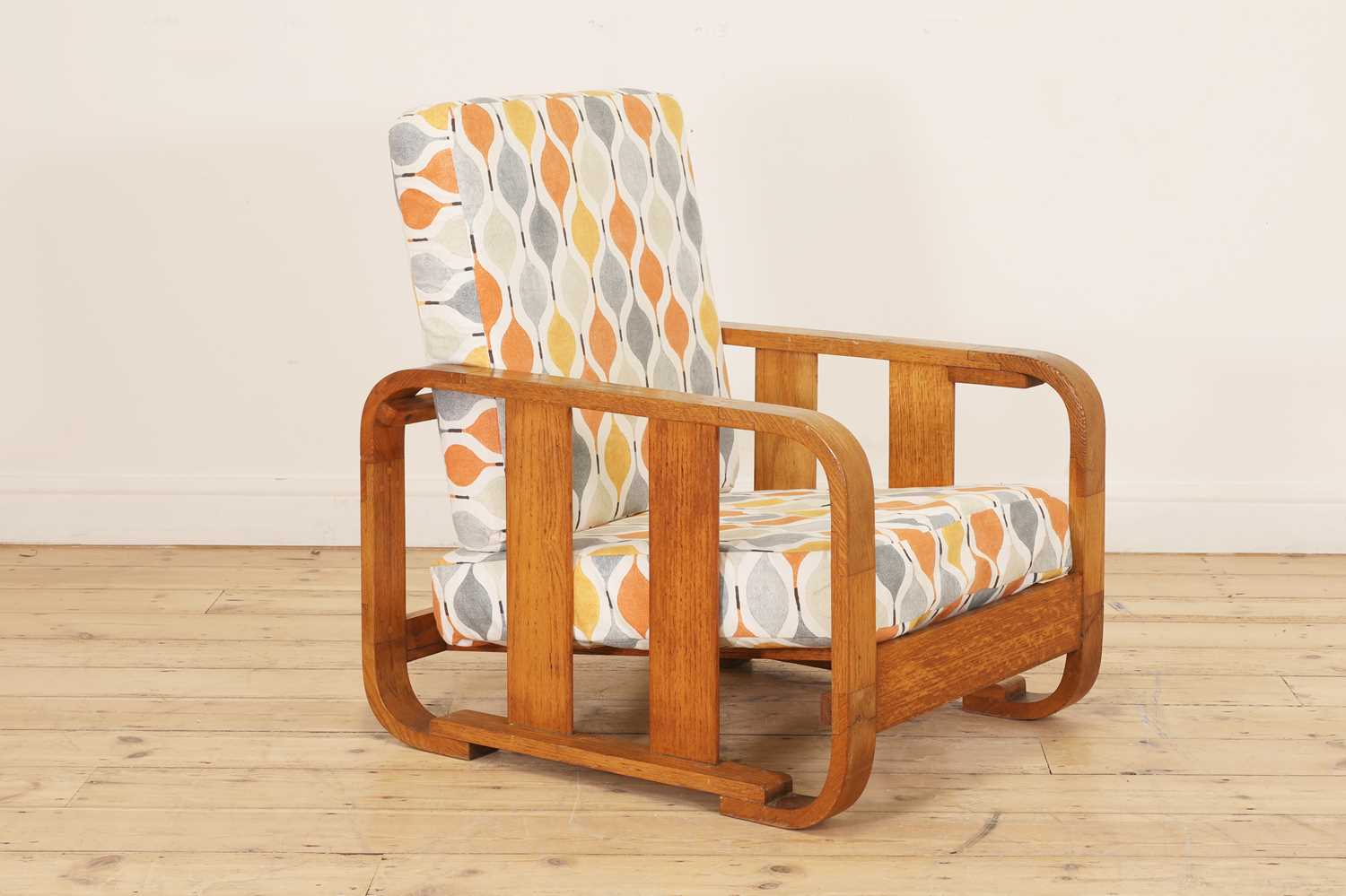 Lot 179 - An oak 'Tank' armchair,