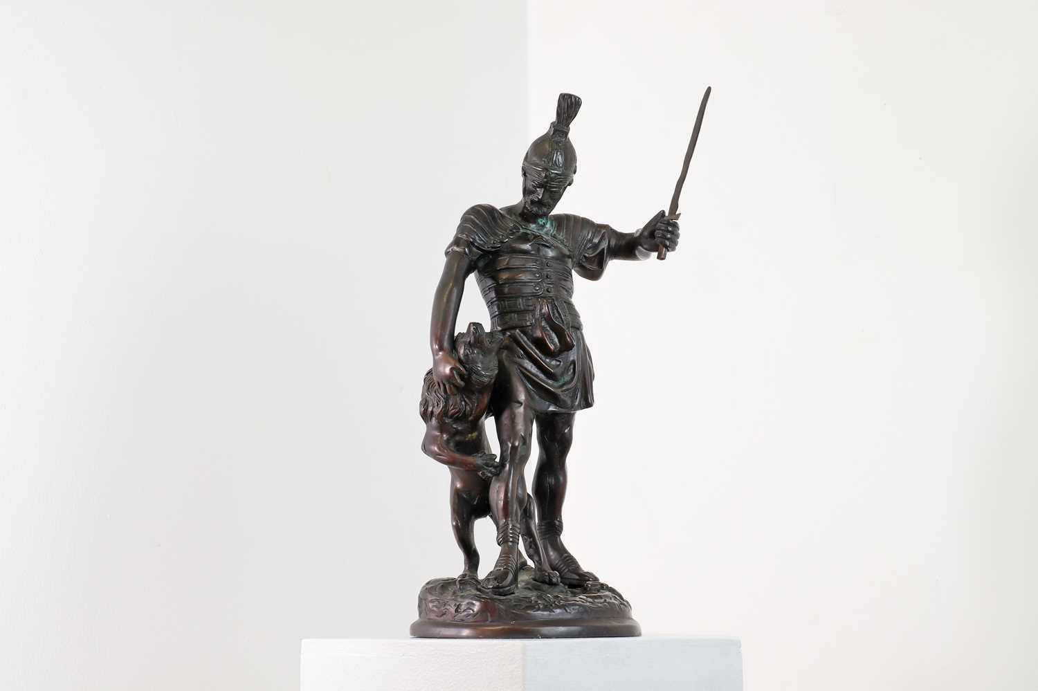 Lot 26 - A patinated bronze figure,