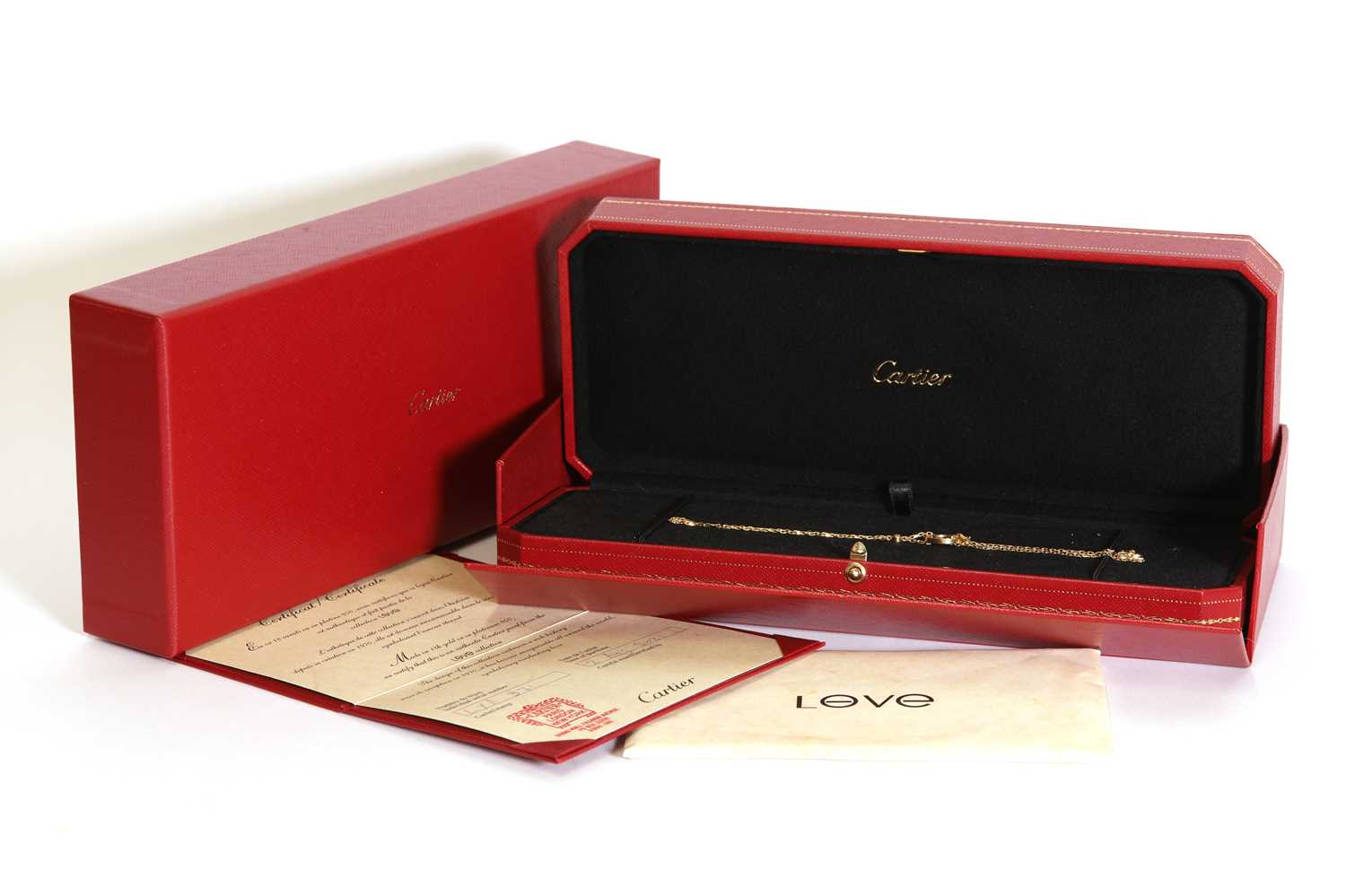 Lot 326 - An 18ct gold diamond set 'Love' bracelet, by