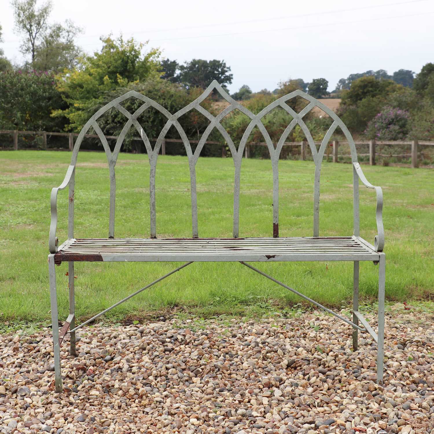 Lot 319 - A Gothic-style wrought iron garden seat,