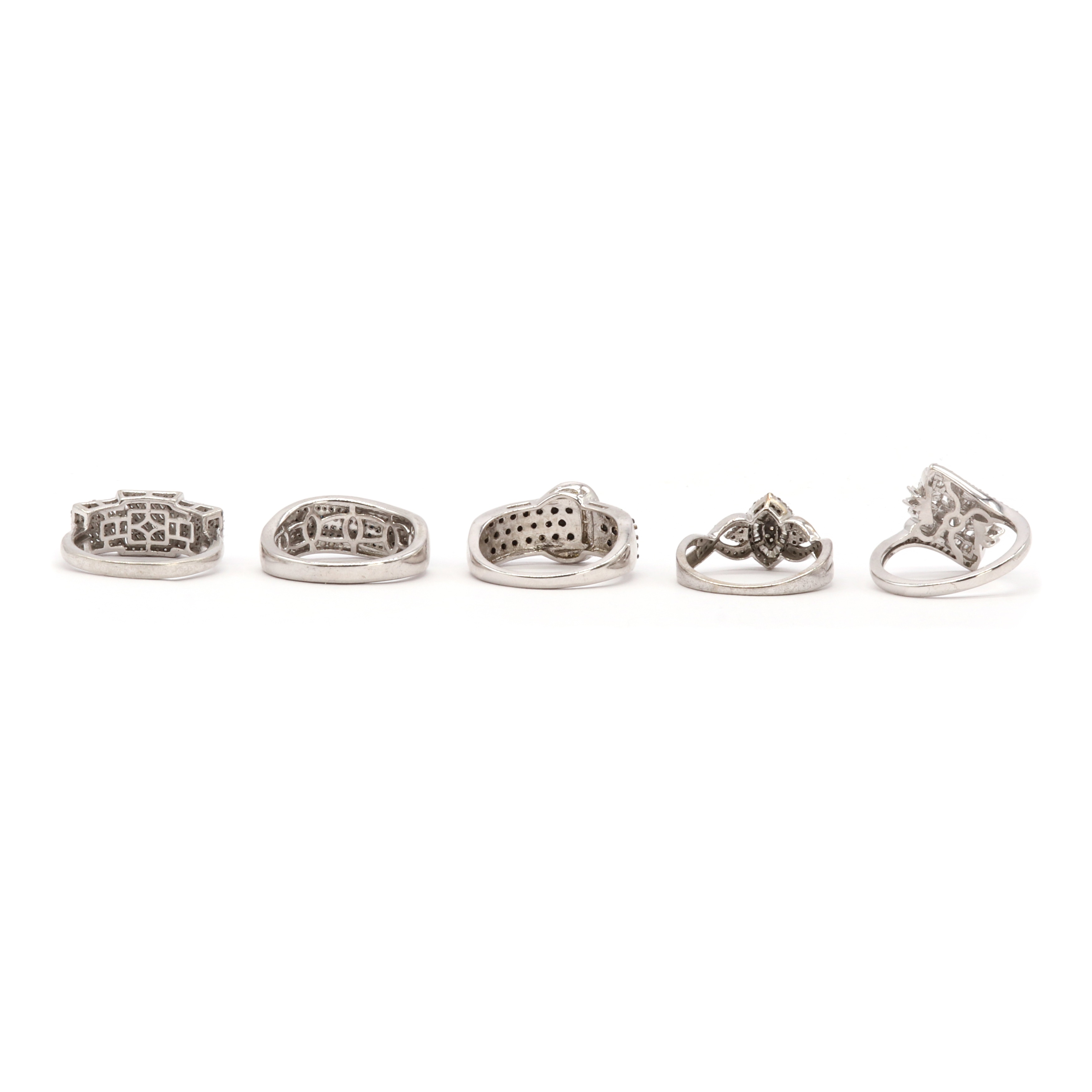 Lot 101 - Five silver diamond set rings,