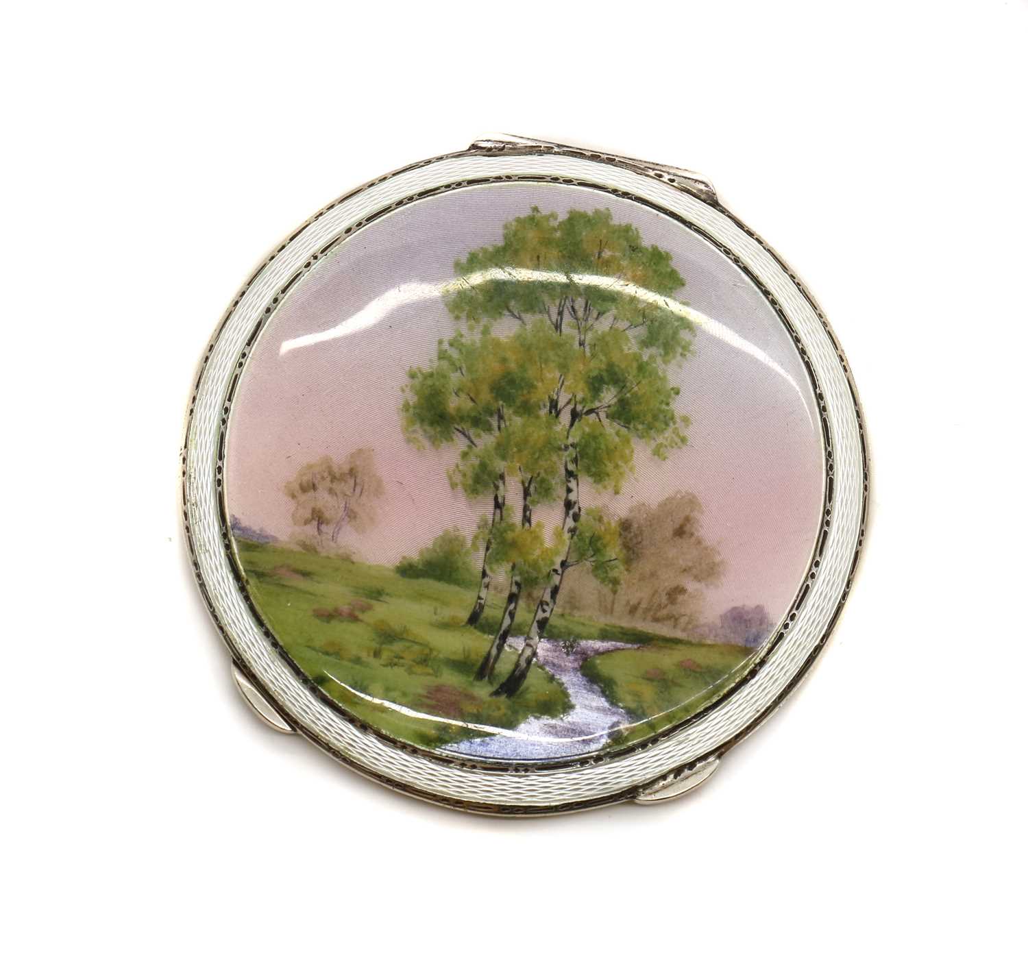 Lot 32 - An enamelled silver compact,