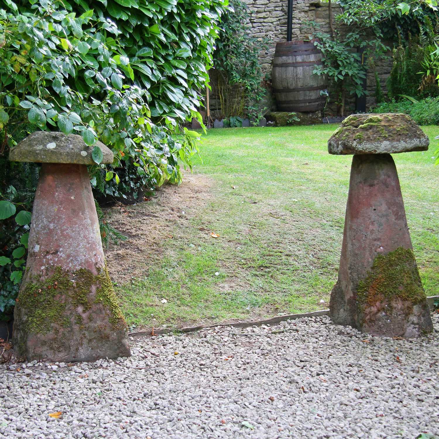 Lot 336 - A pair of tall sandstone staddle stones,