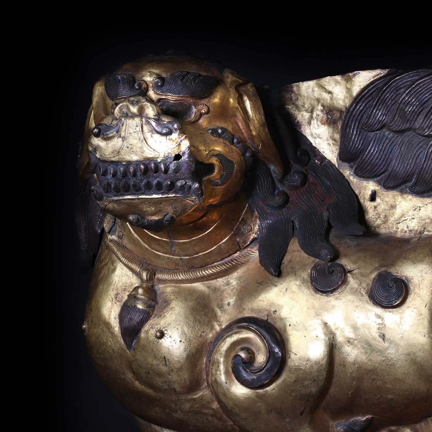 Lot 146 - A Tibetan gilt-copper snow lion,