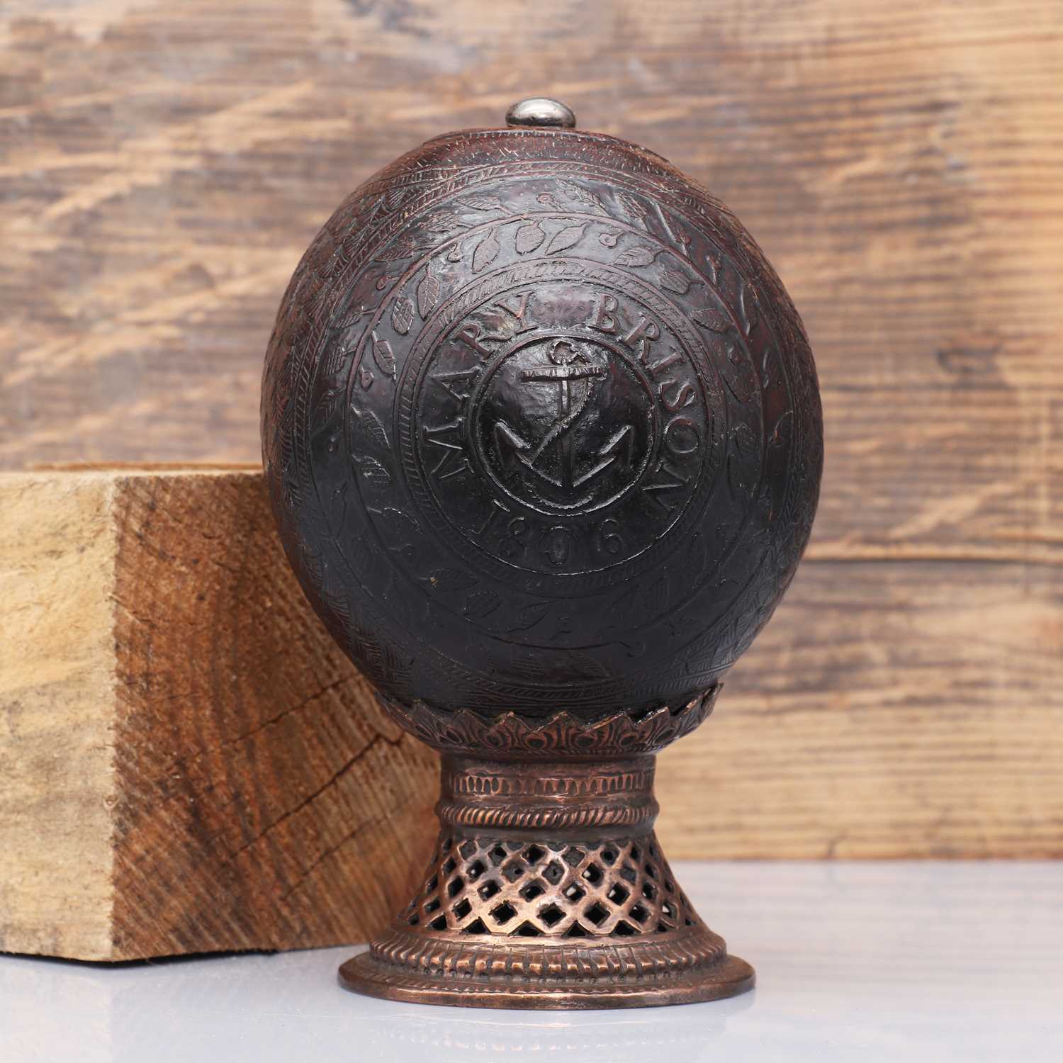 Lot 199 - A carved 'bugbear' coconut flask,