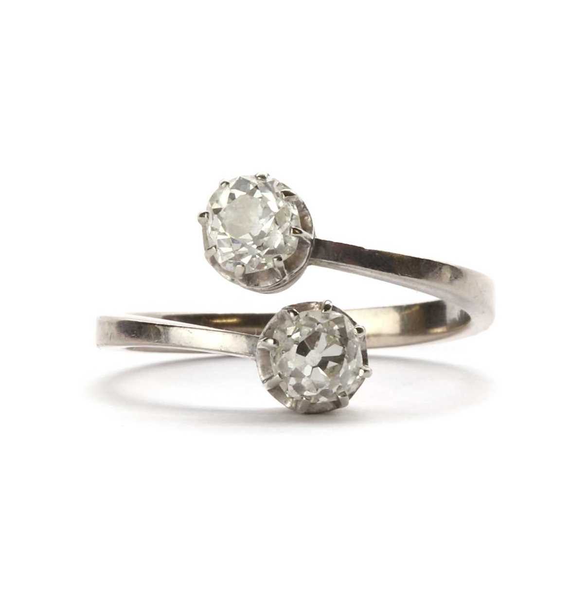 Lot 68 - A white gold diamond open crossover ring,