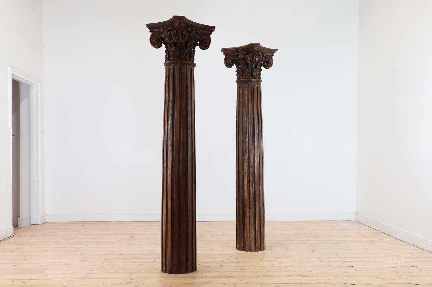 Lot 101 - A pair of carved pine columns,