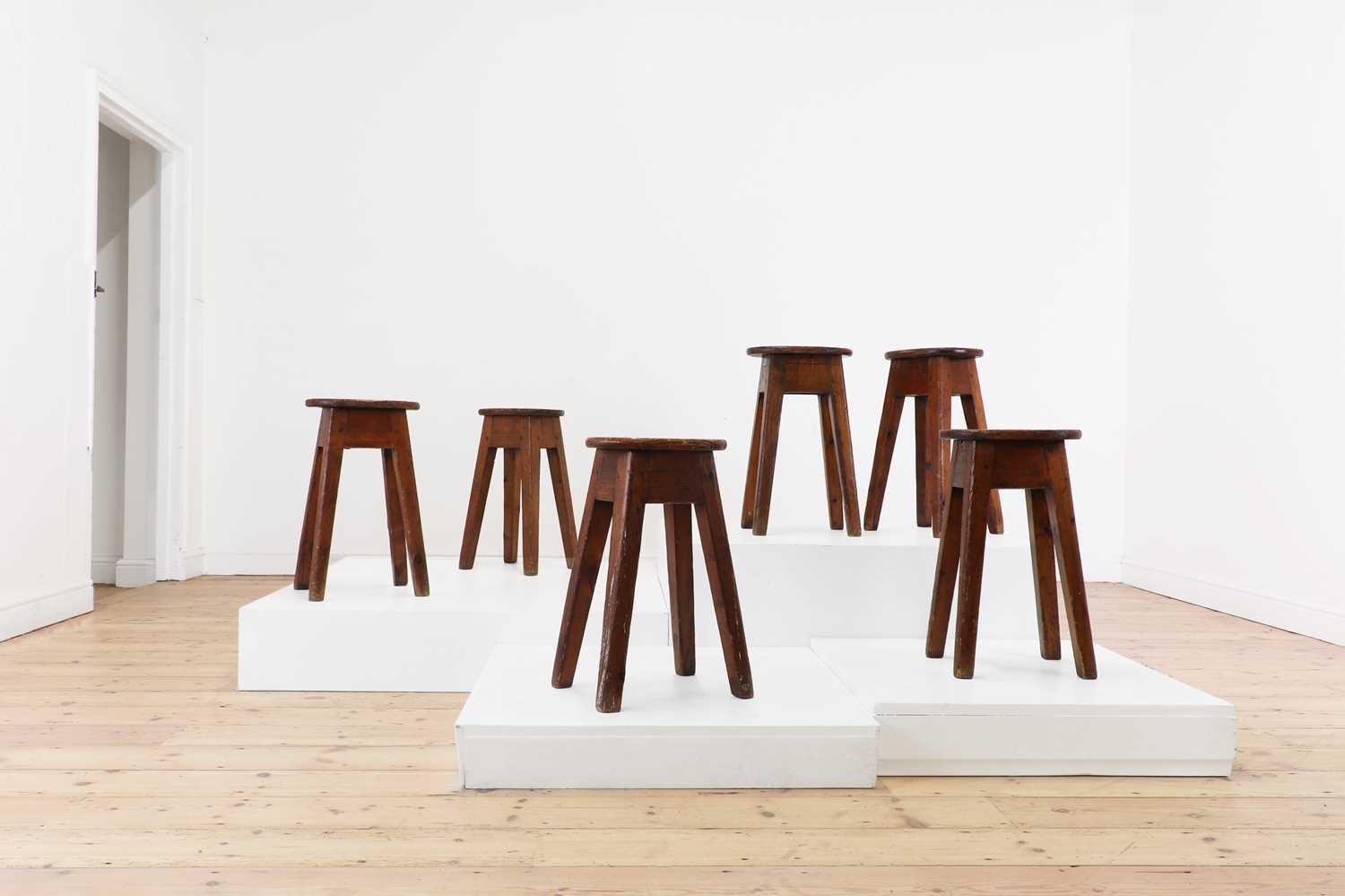 Lot 430 - A set of six pitch pine stools,
