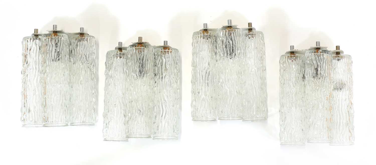 Lot 486 - A set of four textured 'bark' glass wall