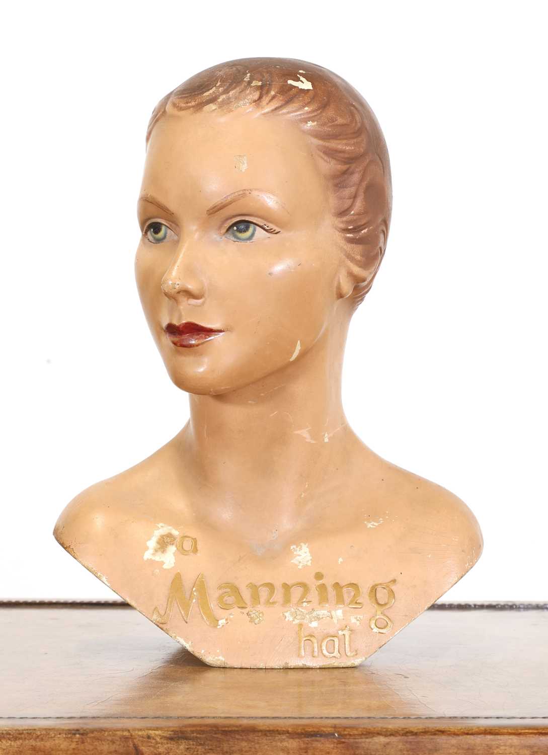 Lot 170 - A composition and painted advertising bust,