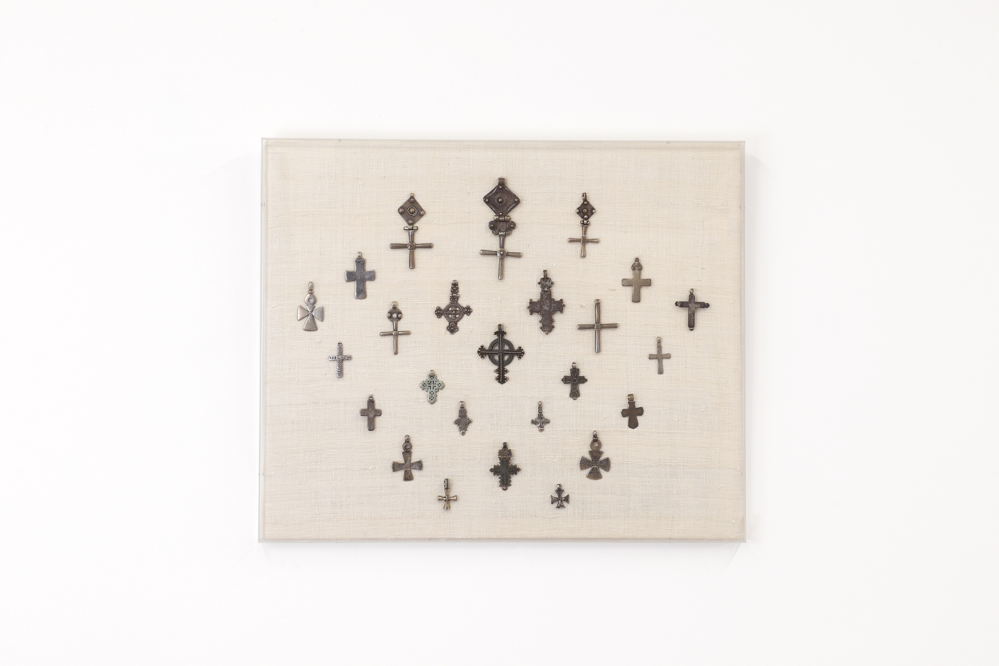 Lot 54 - A framed display of Coptic crosses,