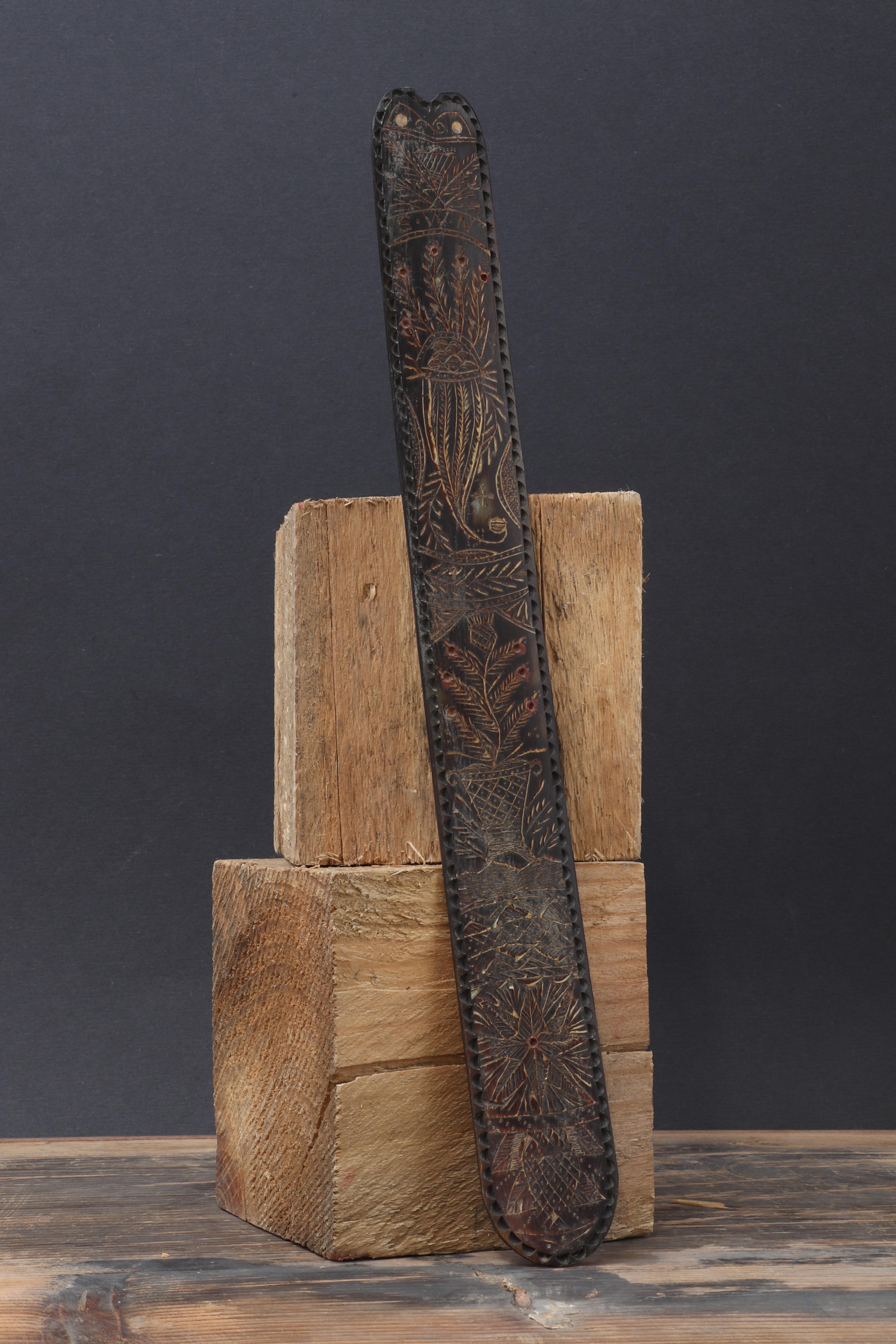 Lot 485 - A carved baleen whalebone corset stay busk,