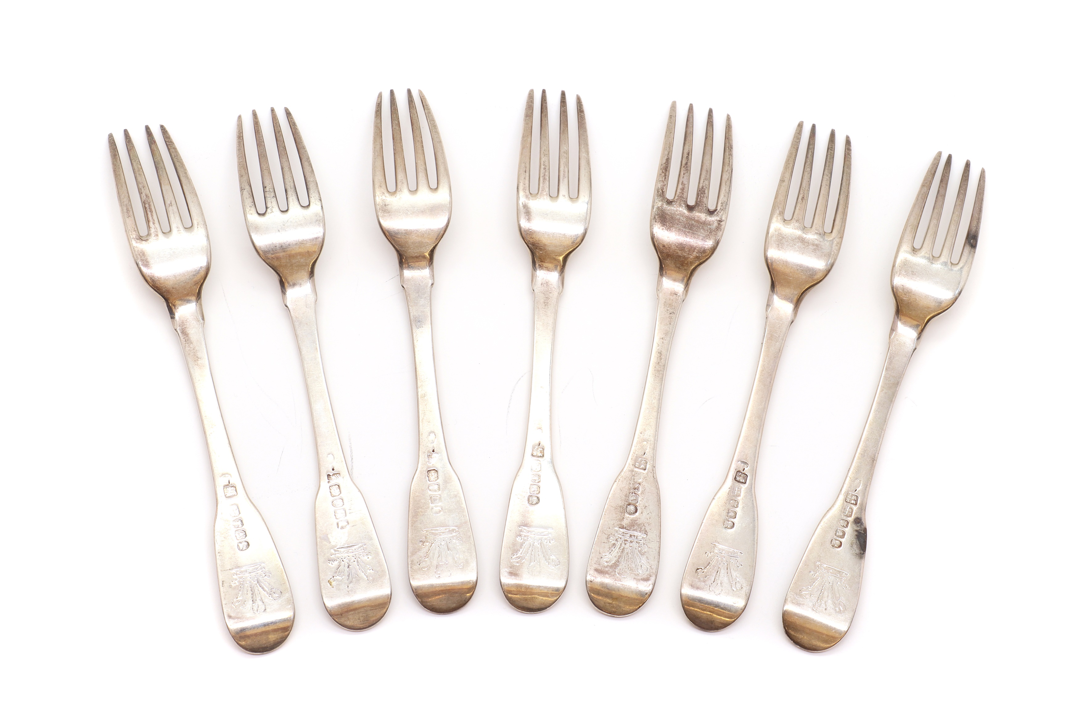 Lot 26 - A set of seven George III silver forks