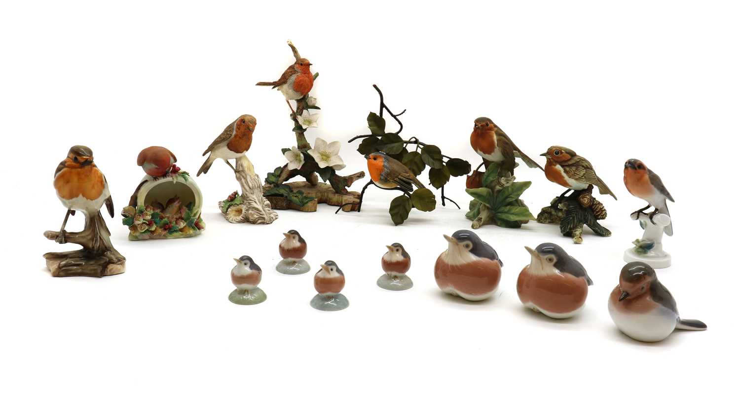 Lot 104 - A collection of porcelain models of robins