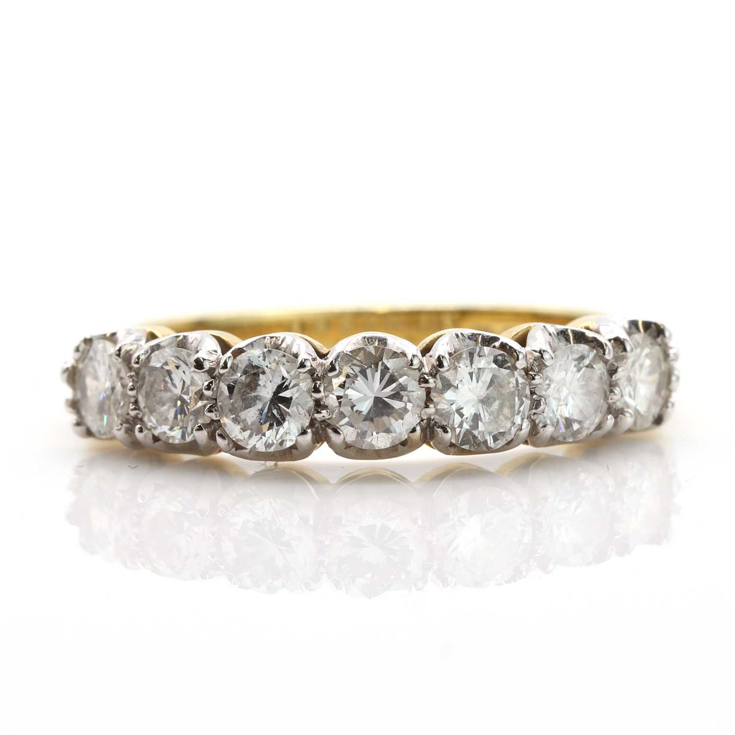 Lot 203 - An 18ct gold seven stone diamond half