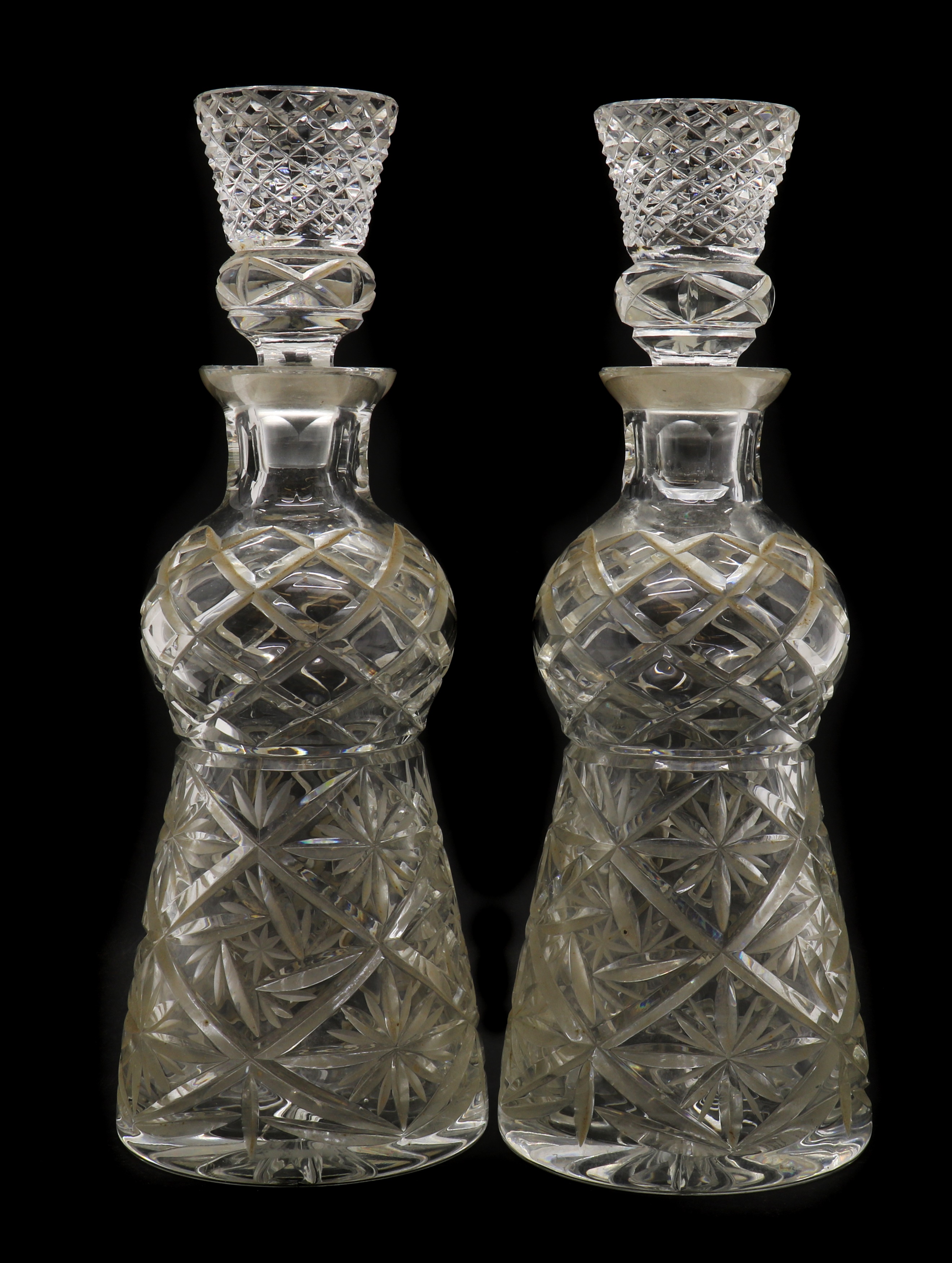 Lot 153 - A pair of cut glass thistle shaped decanters