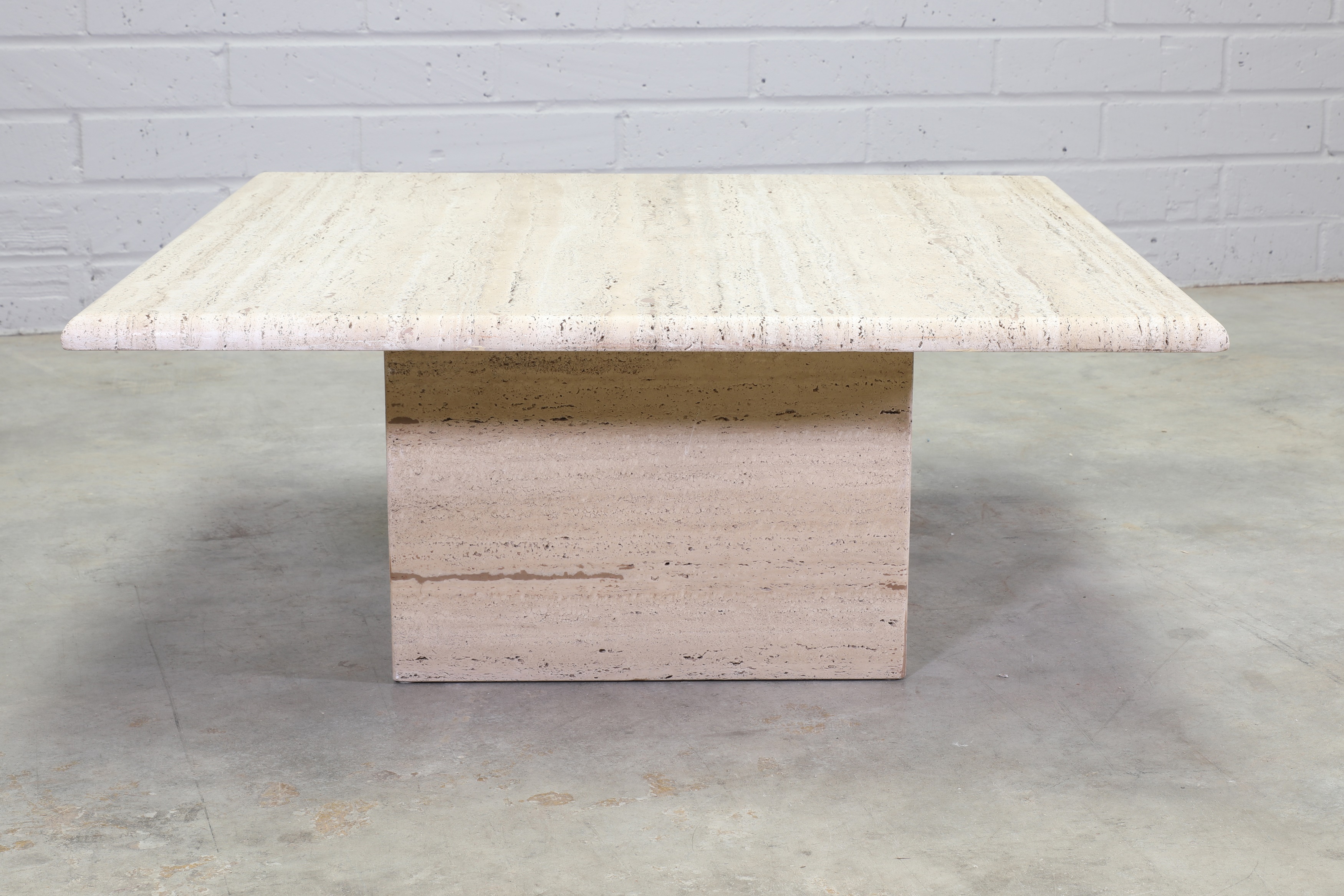 Lot 611 - A travertine marble coffee table,