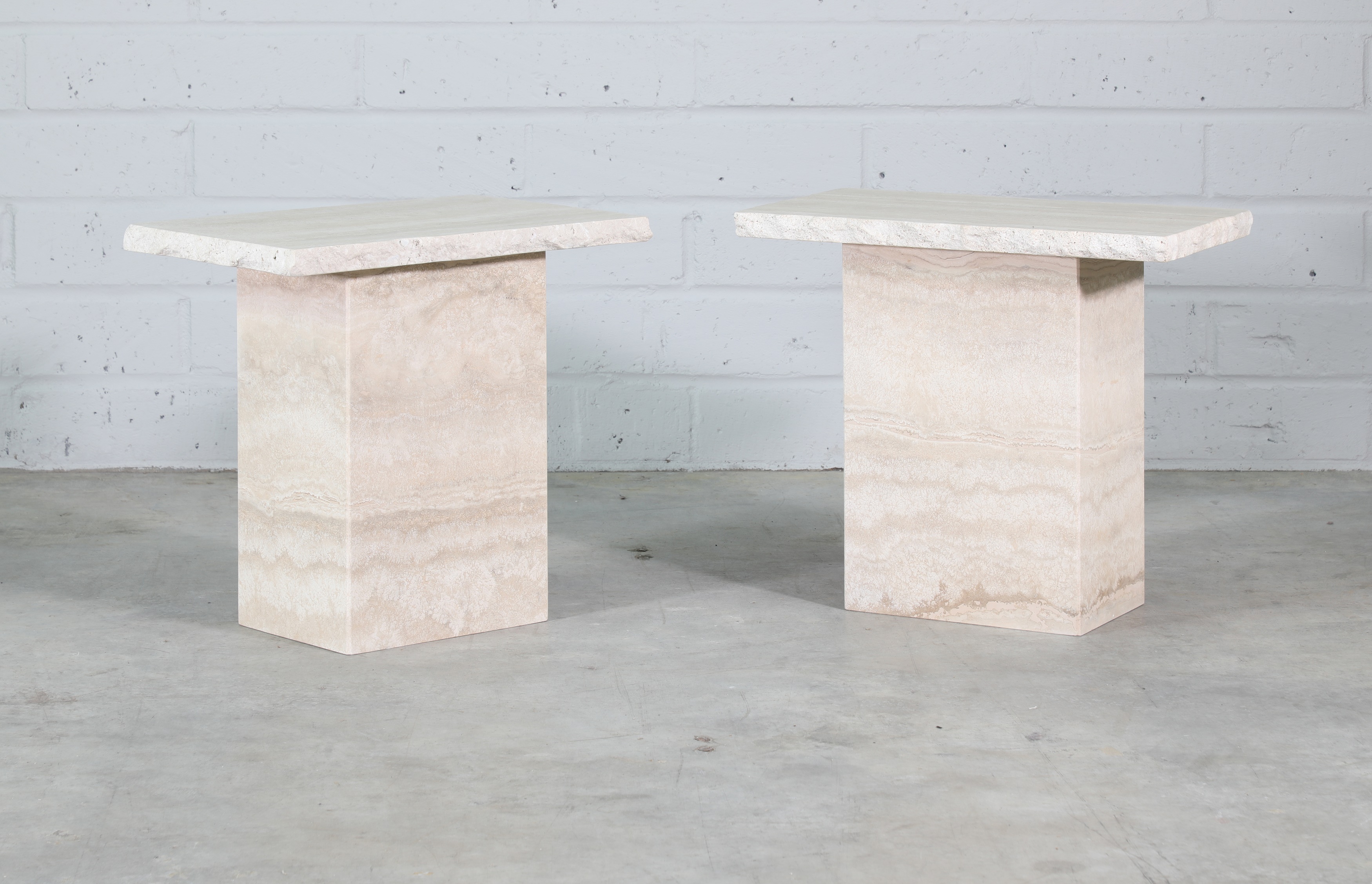 Lot 552 - A pair of contemporary travertine marble